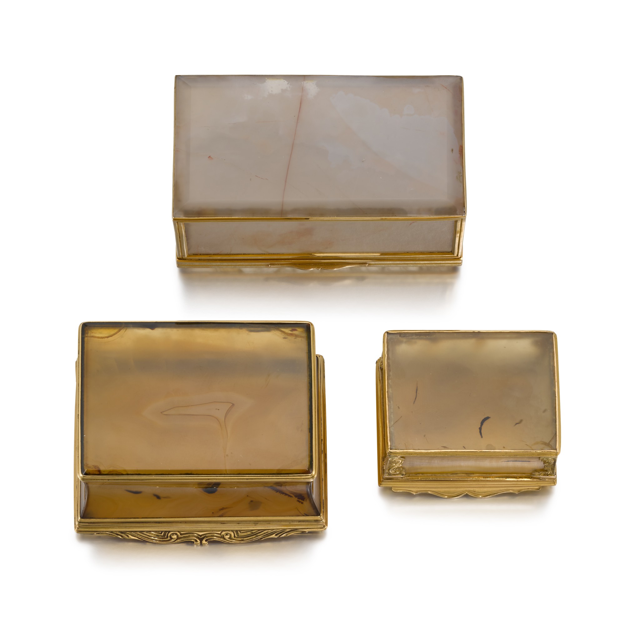 A group of three agate snuff boxes with gold cagework mounts, various ...
