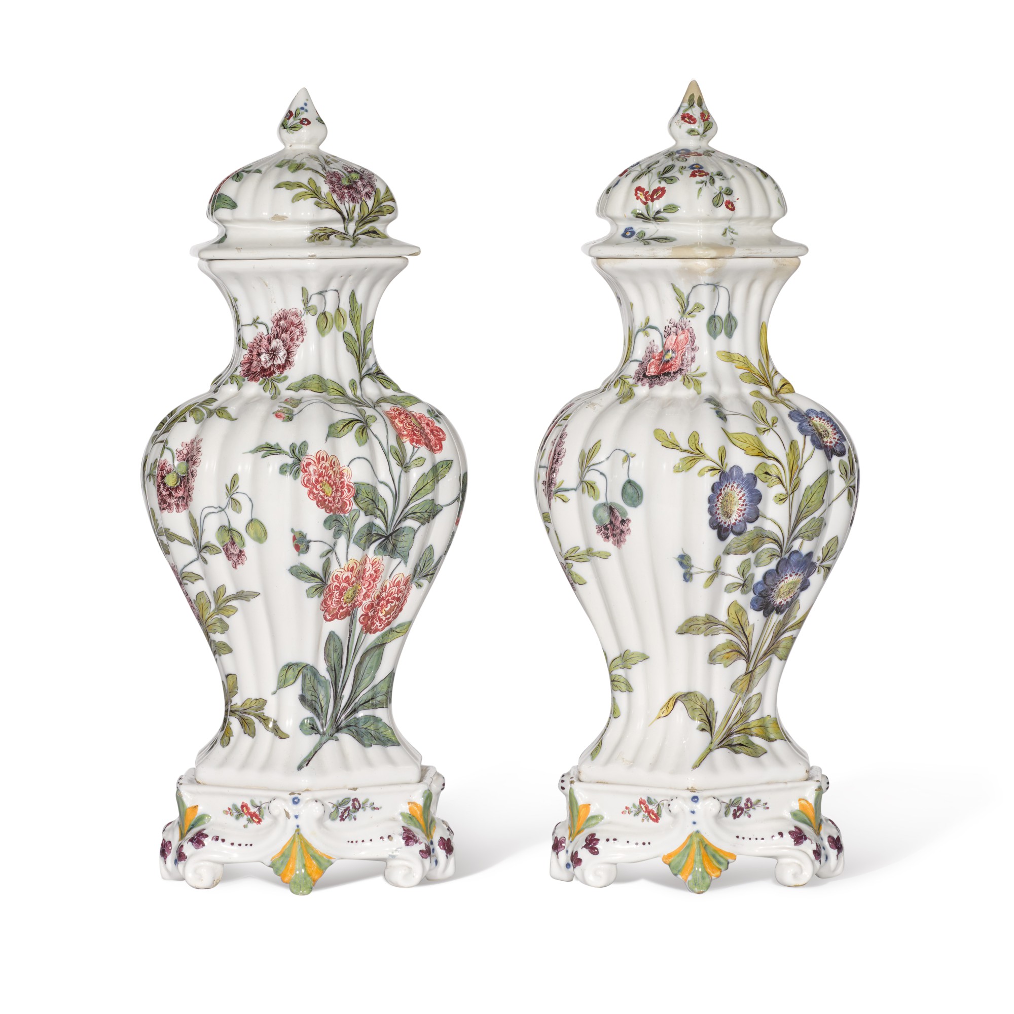 A pair of Nove maiolica hexagonal section baluster vases, covers and ...