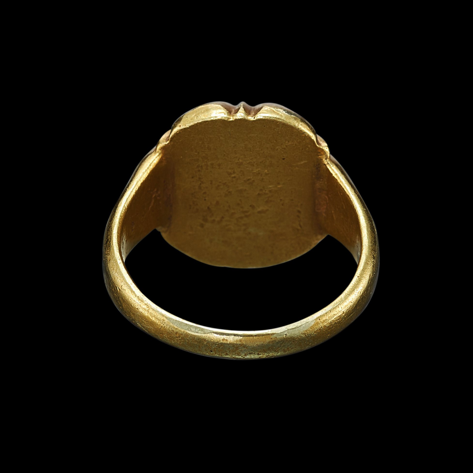 A solid gold ring with scallop shank and incised 'Sri' symbol Java ...