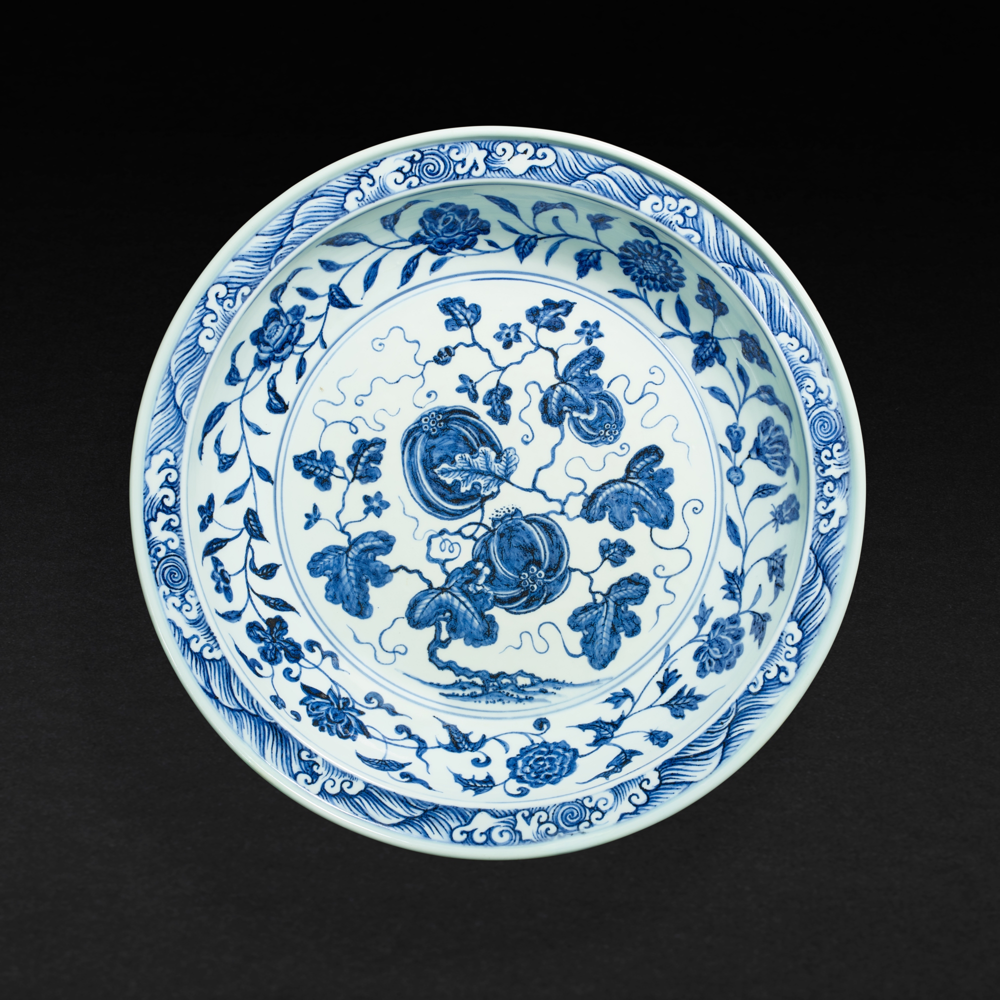 A very rare and finely painted blue and white 'melon' charger, Ming ...