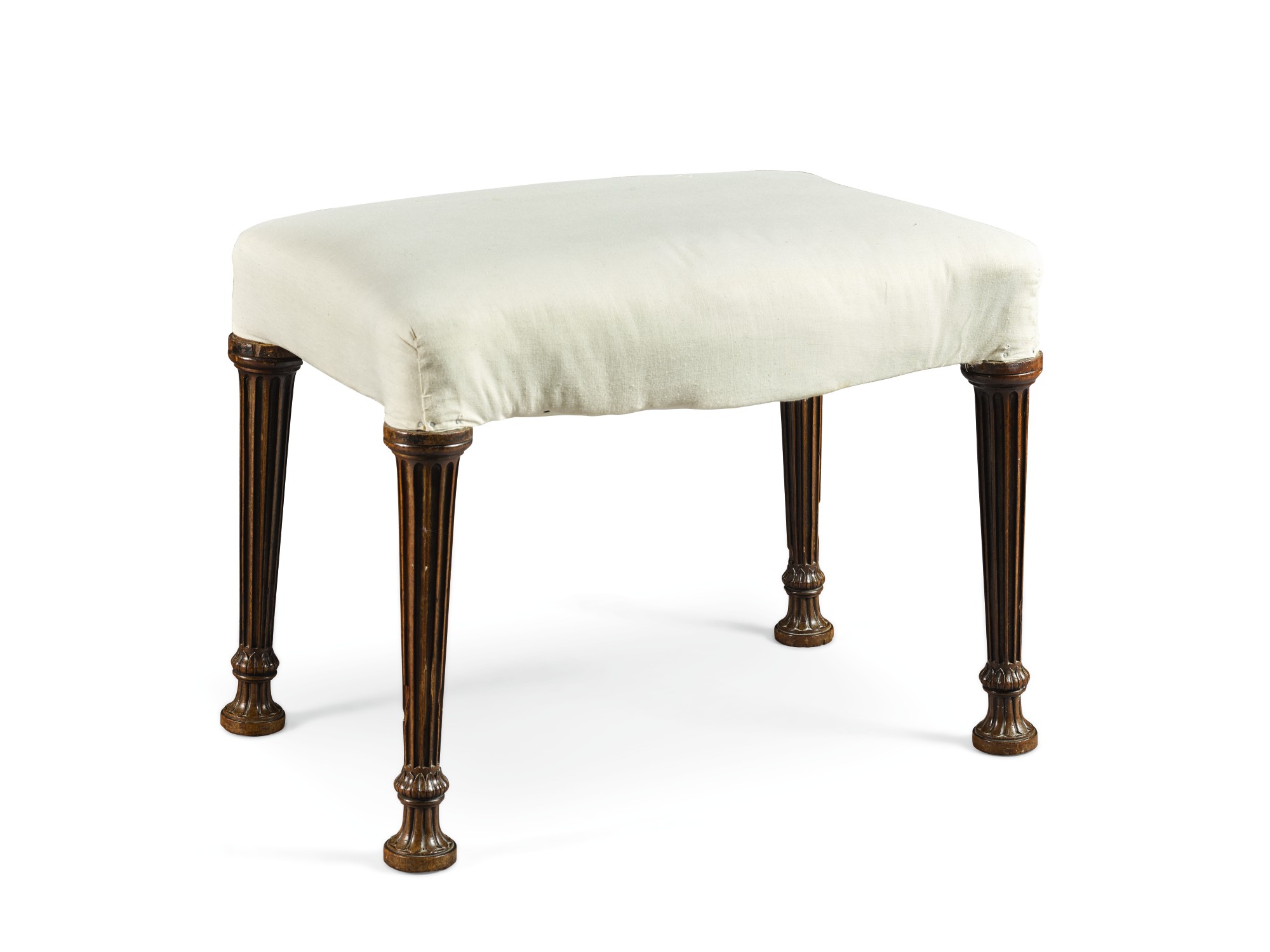 A George III serpentine mahogany stool by Thomas Chippendale, 1772 ...