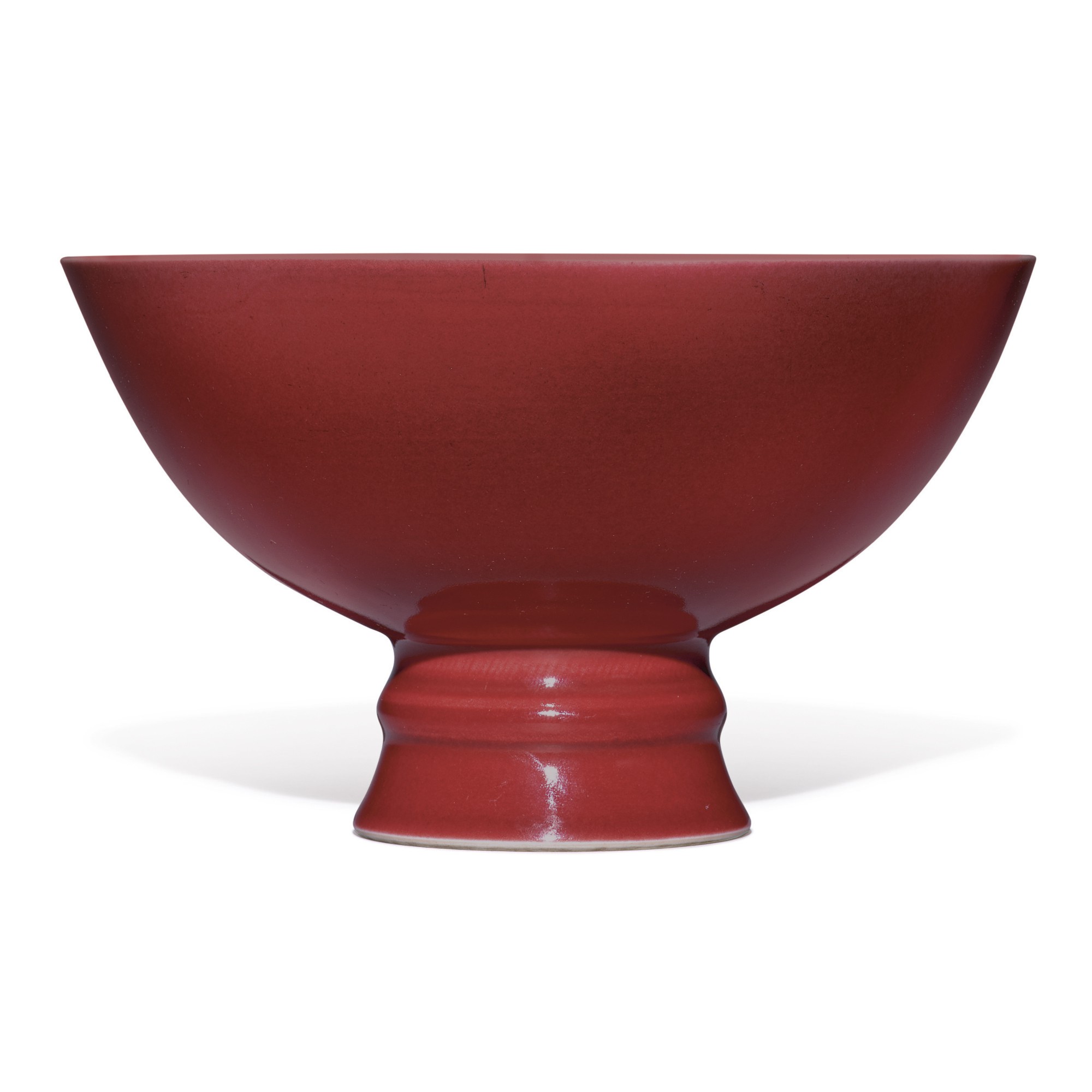 A COPPER-RED-GLAZED STEM BOWL, QIANLONG SEAL MARK AND PERIOD ...
