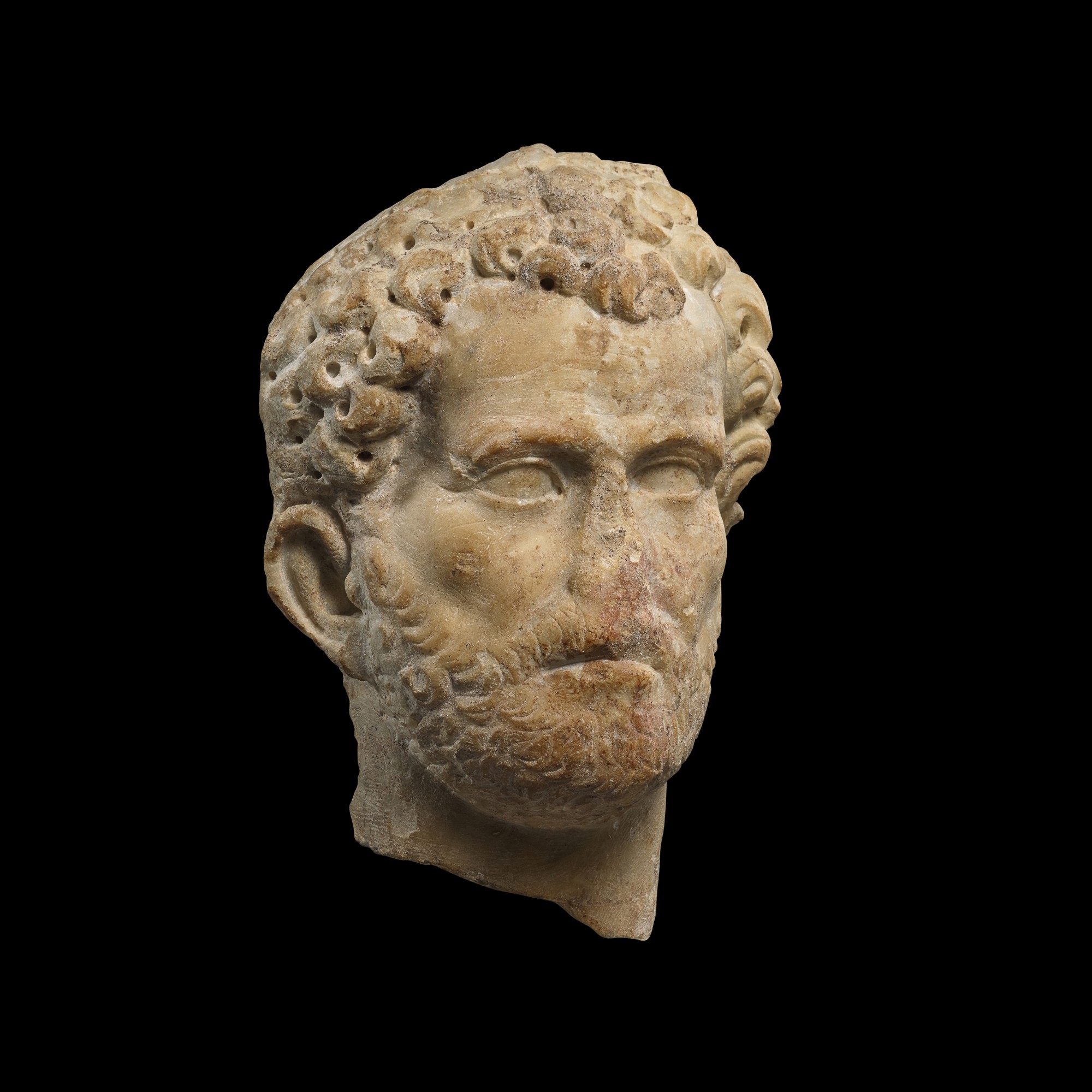 A ROMAN MARBLE RELIEF PORTRAIT HEAD OF A MAN, ANTONINE, PROBABLY ...