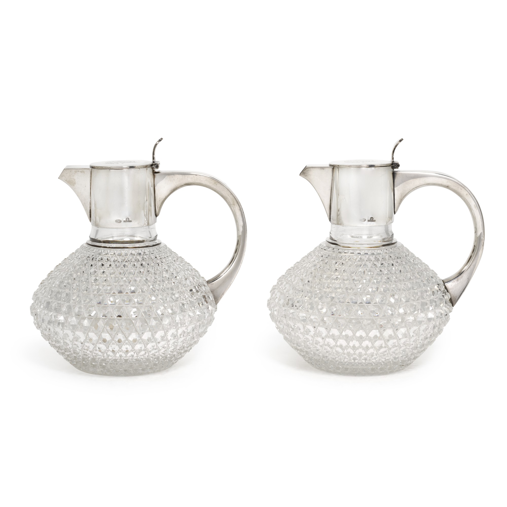 A pair of Fabergé silver-mounted cut-glass decanters, Moscow, 1899-1908 ...