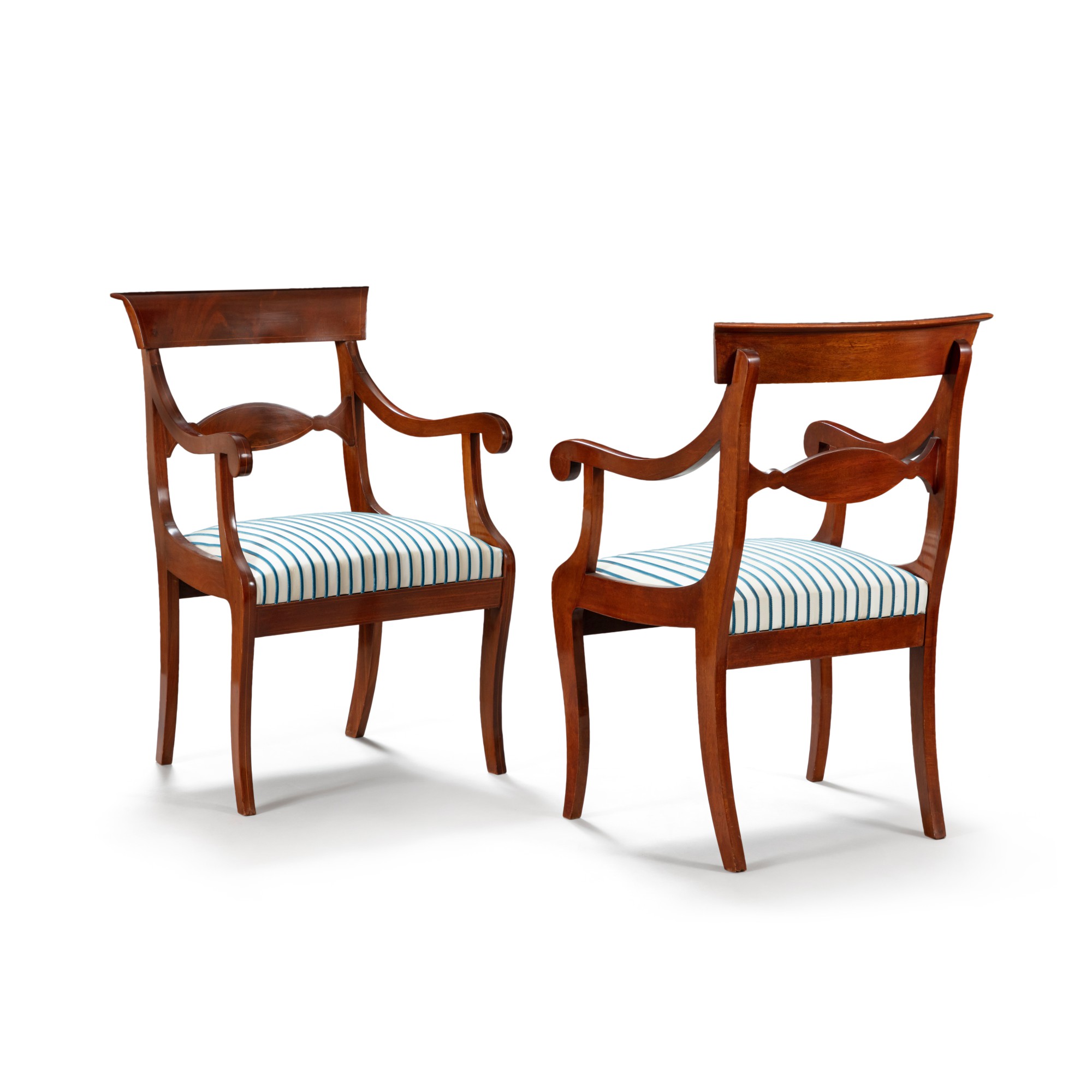 A pair of North German Georgian style mahogany armchairs with two ...