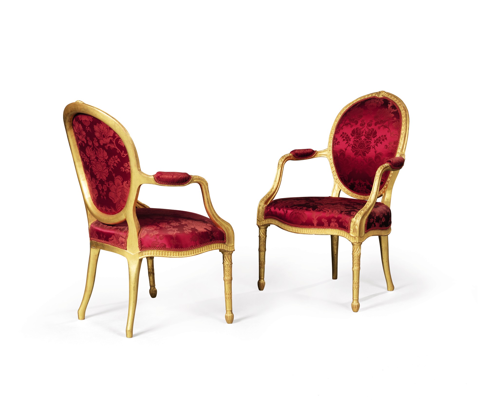 A pair of George III giltwood armchairs, in the manner of John Linnell ...
