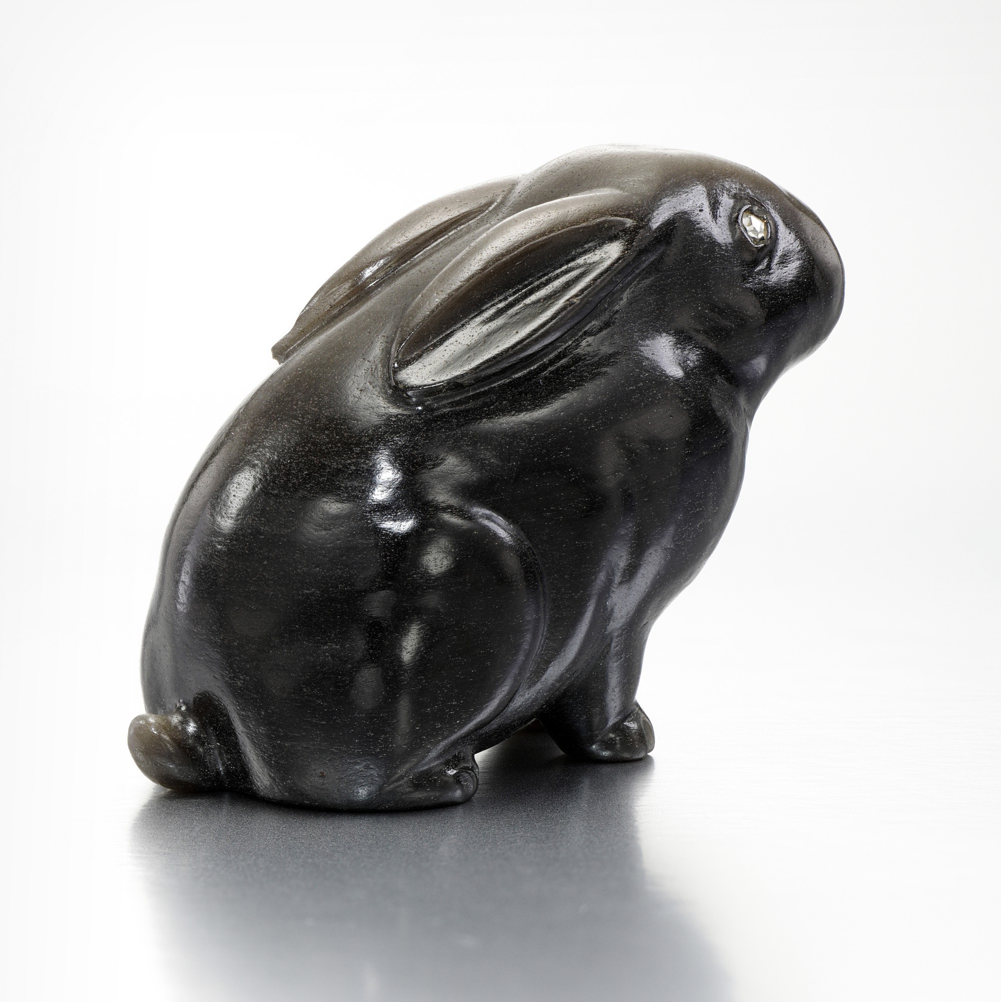 A FABERGÉ JEWELLED OBSIDIAN MODEL OF A RABBIT, ST PETERSBURG, CIRCA ...