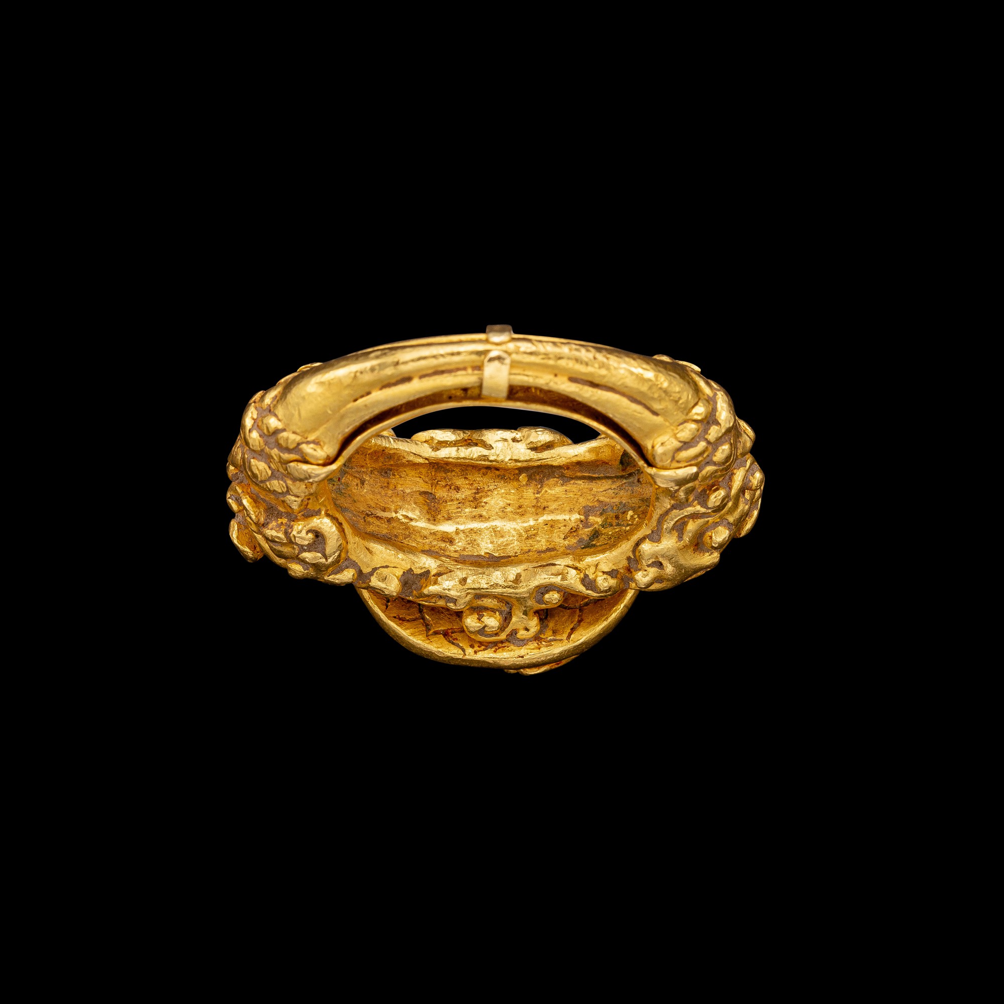 A gold 'Shiva and Parvati riding on Nandi' ring Khmer, Angkor period ...