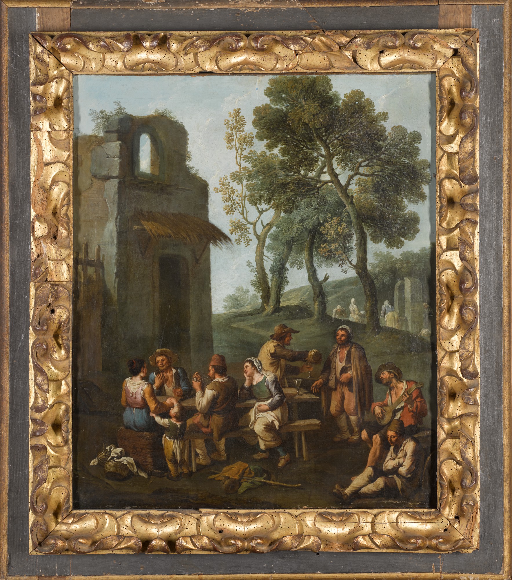 PAOLO MONALDI | A landscape with peasants sitting and drinking by a ...