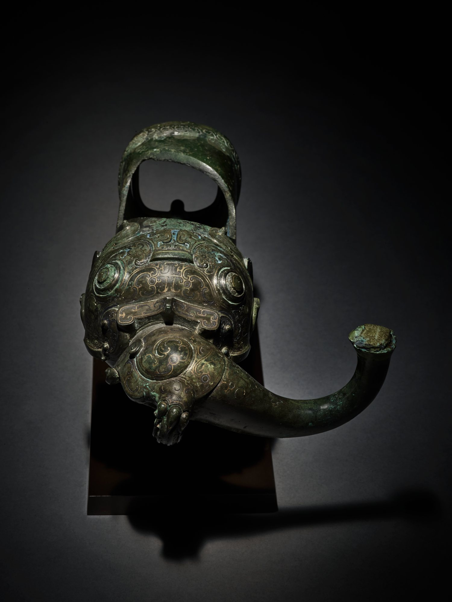 An exceptionally rare silver and gold-inlaid zoomorphic fitting Eastern ...