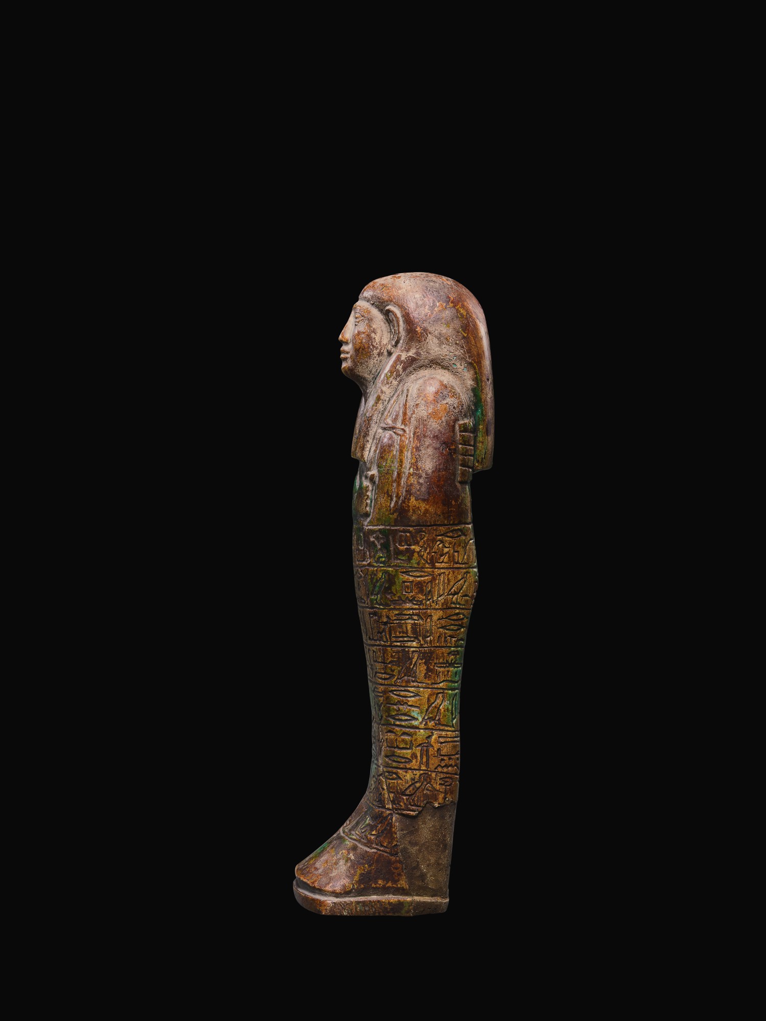 AN EGYPTIAN BLUE-GREEN GLAZED STEATITE USHABTI OF THE CHIEF LECTOR ...