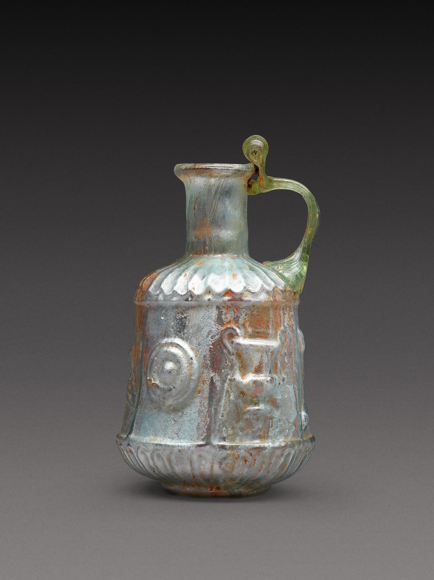 A Roman Pale Green Mould-Blown Glass Flask, circa 1st century A.D ...