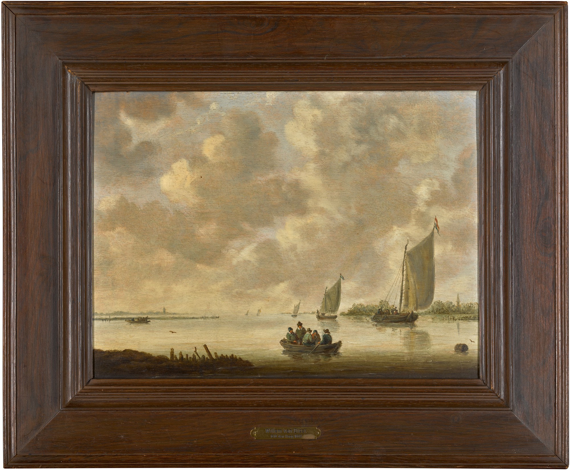 WILLEM VAN DIEST | A RIVER LANDSCAPE WITH FIGURES IN A ROWING BOAT ...
