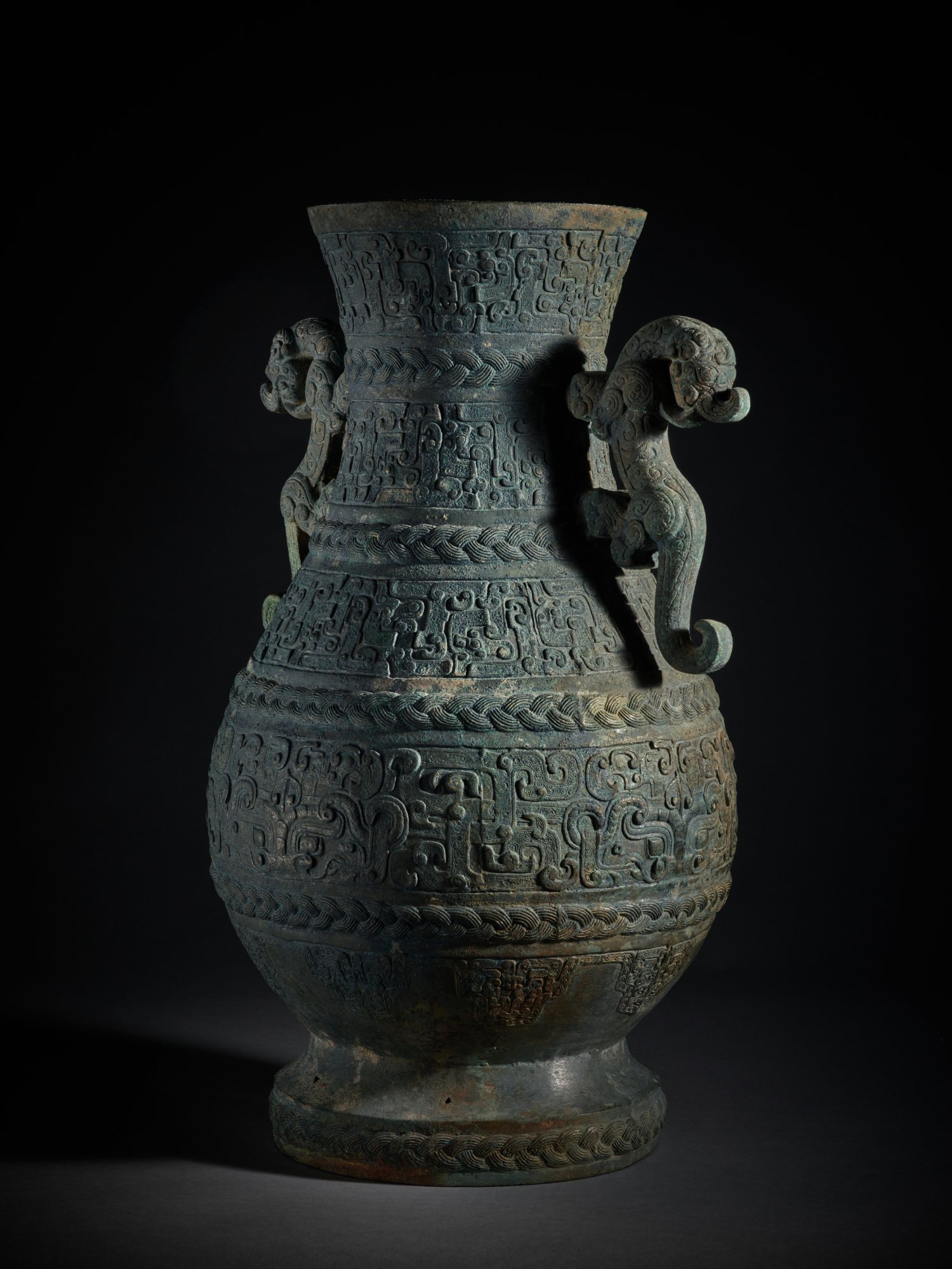 An exceptional and rare archaic bronze wine vessel (Hu), Eastern Zhou ...