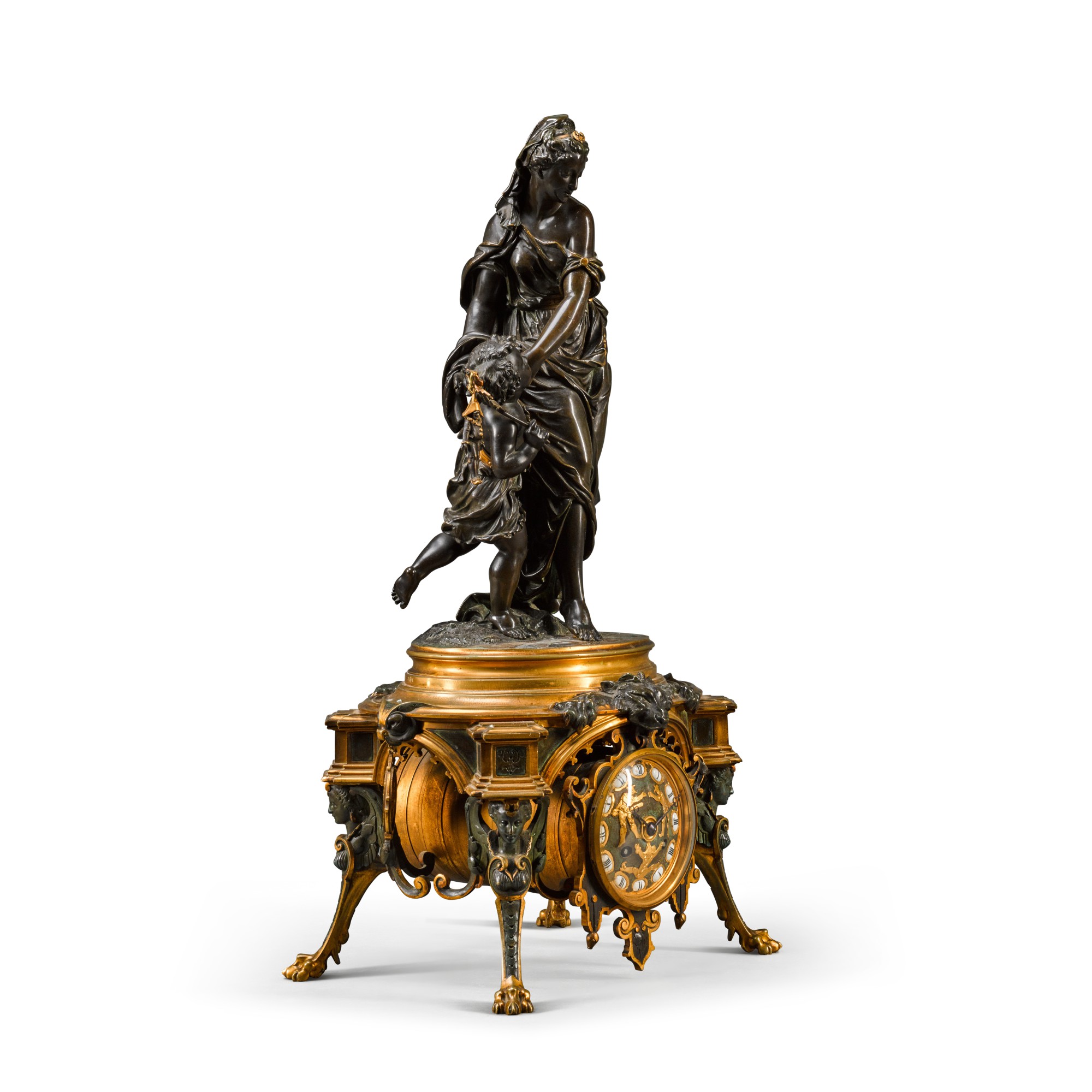 A gilt and patinated bronze three-piece clock garniture, Ferdinand ...