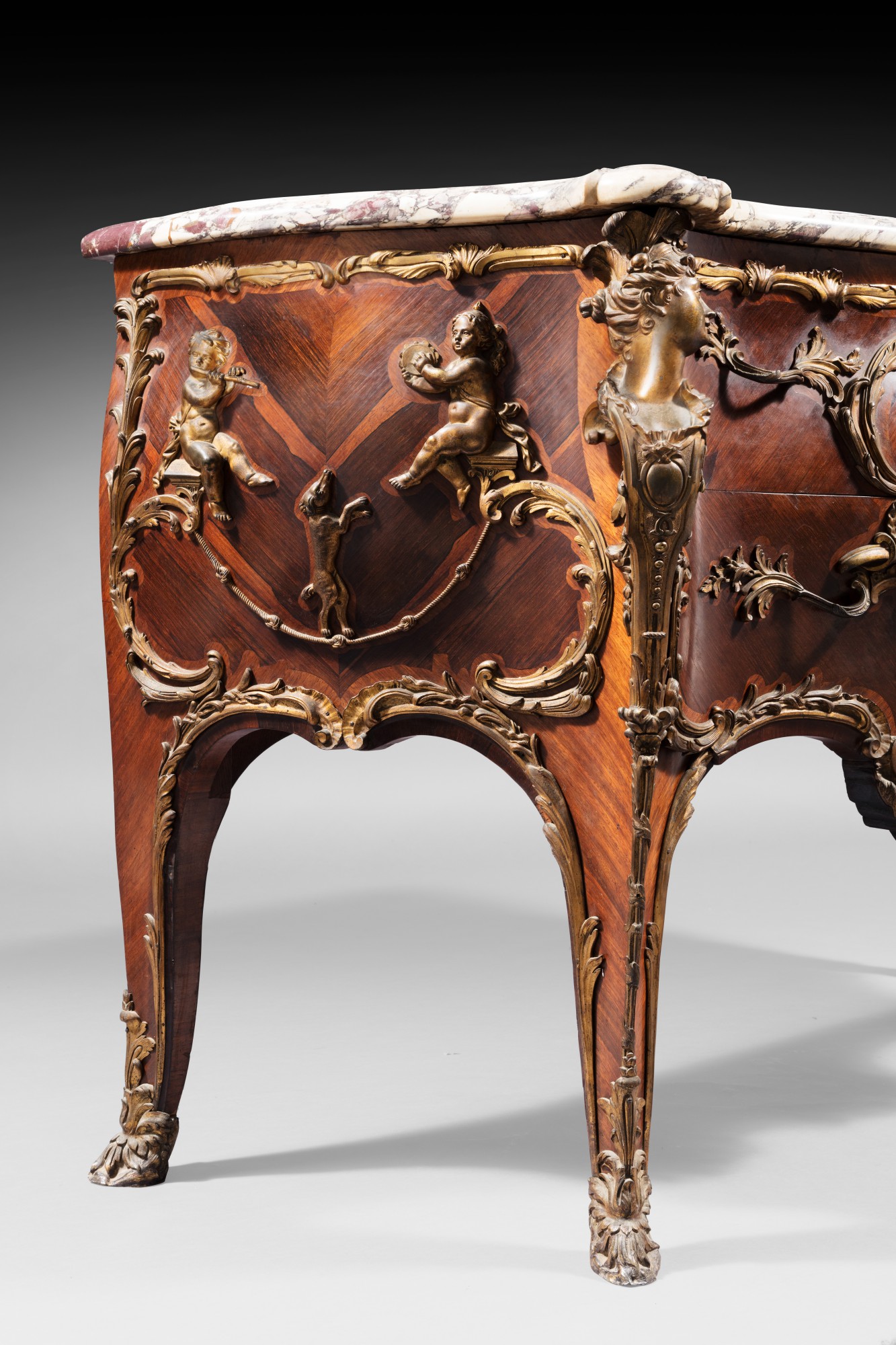 A Louis XV style giltbronze mounted tulipwood and palissander commode ...