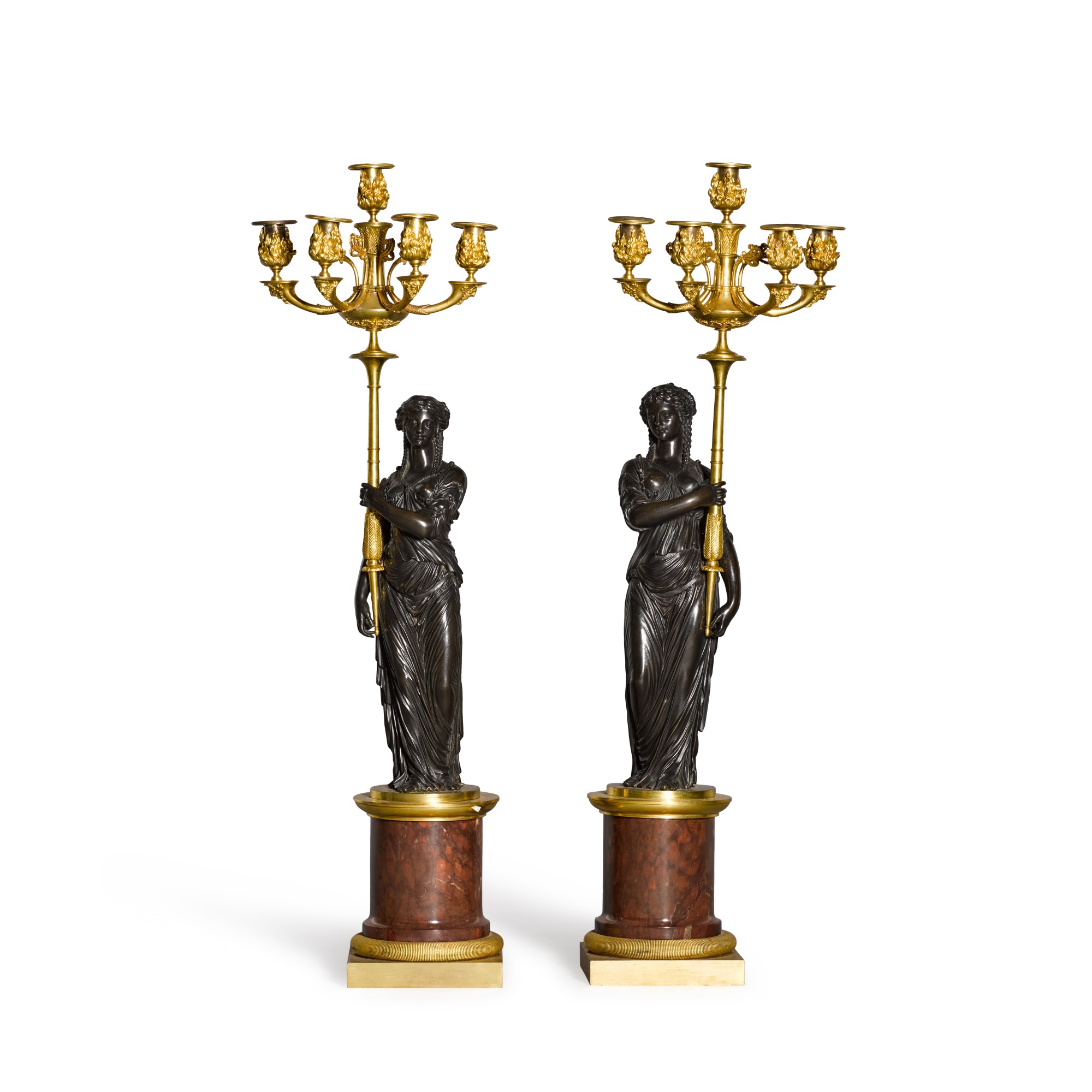 A pair of Directoire gilt and patinated bronze five-light candelabra ...