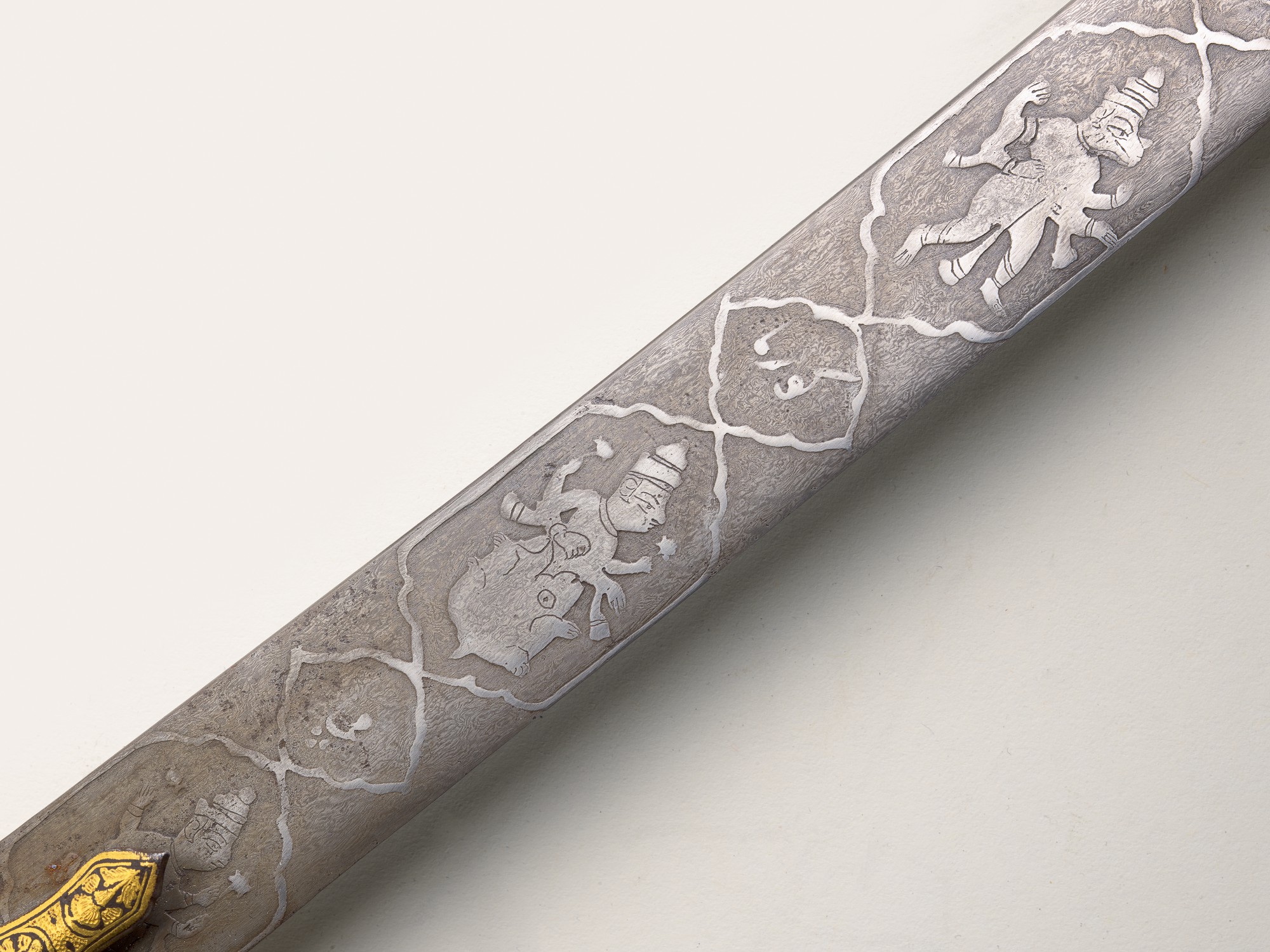 A steel-hilted sword (talwar) and scabbard, the blade with the ten ...