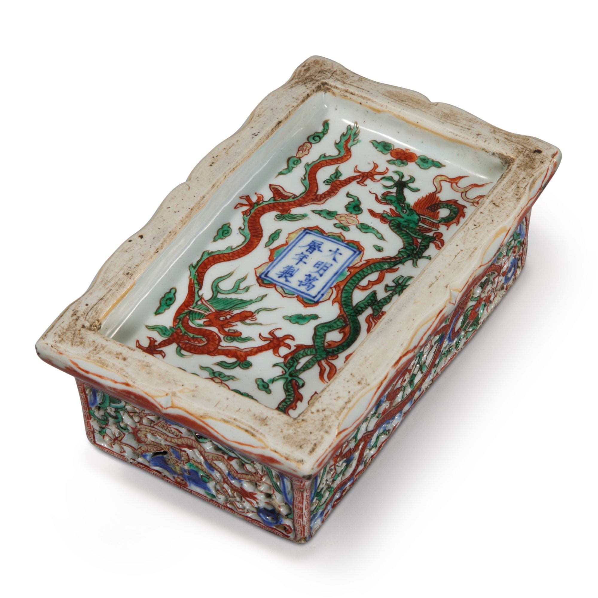 A rare wucai 'dragon' rectangular inkstone, Mark and period of Wanli ...