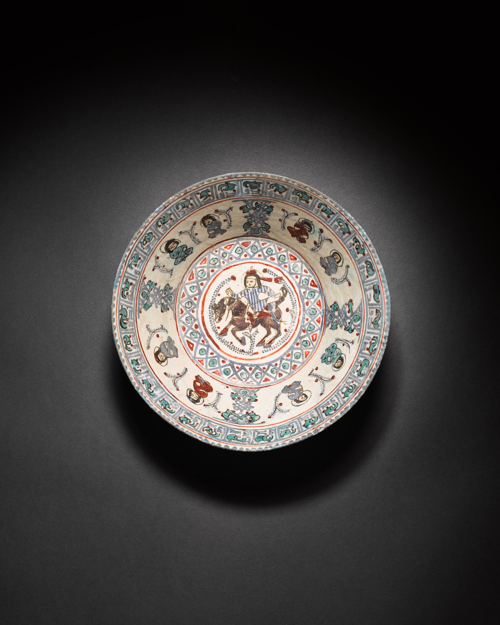 A fine minai pottery bowl depicting a horseman, Persia, late 12th-early ...