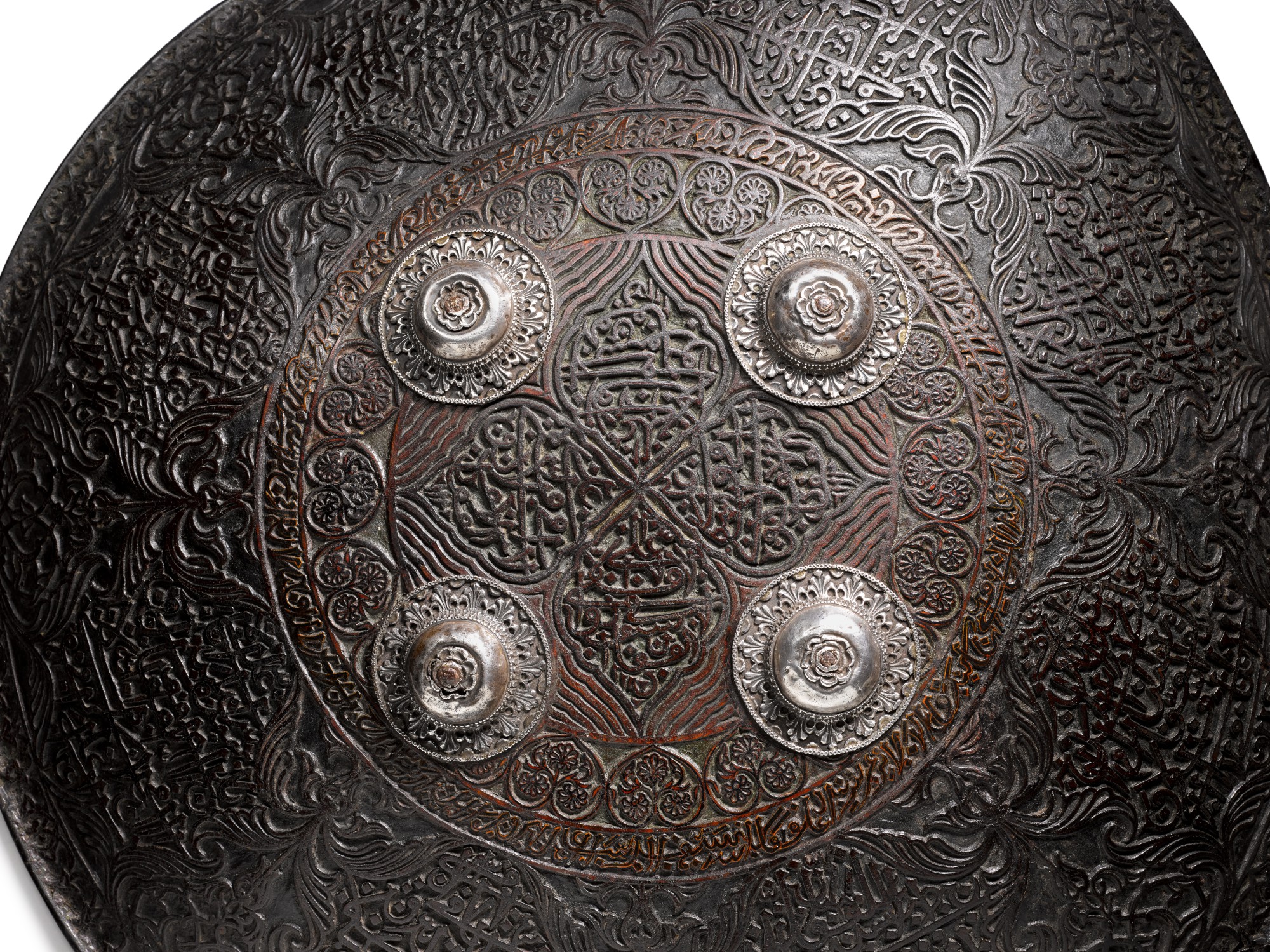 A carved leather shield (dhal) with silver bosses, India, probably ...