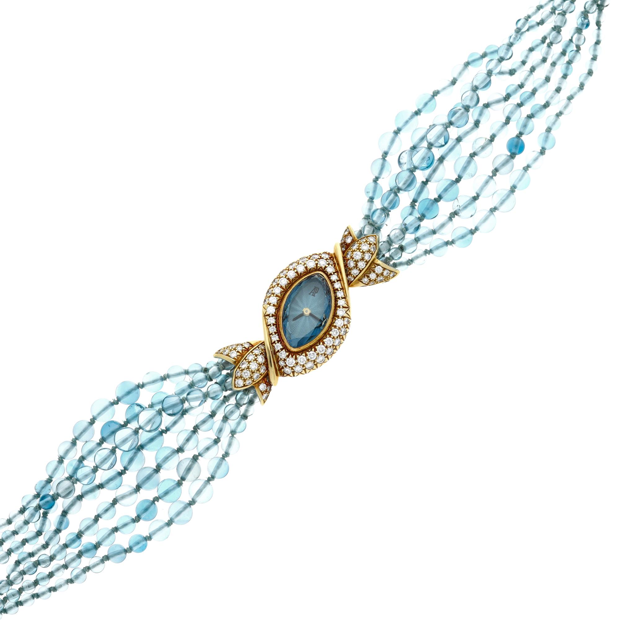 A yellow gold and diamond-set watch with blue topaz beads bracelet ...