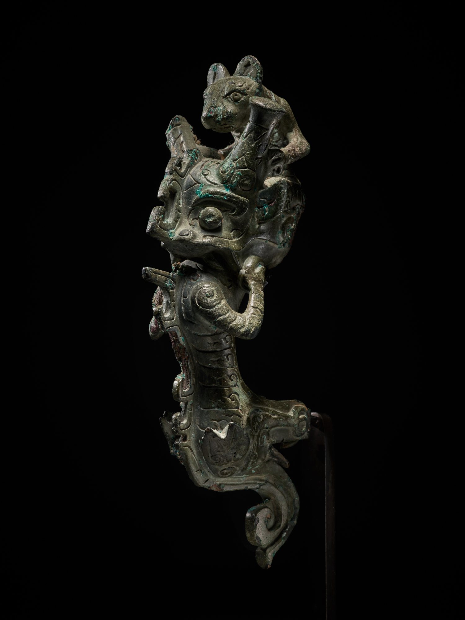 An exceptional and rare archaic bronze 'mythical beast' handle, Late ...