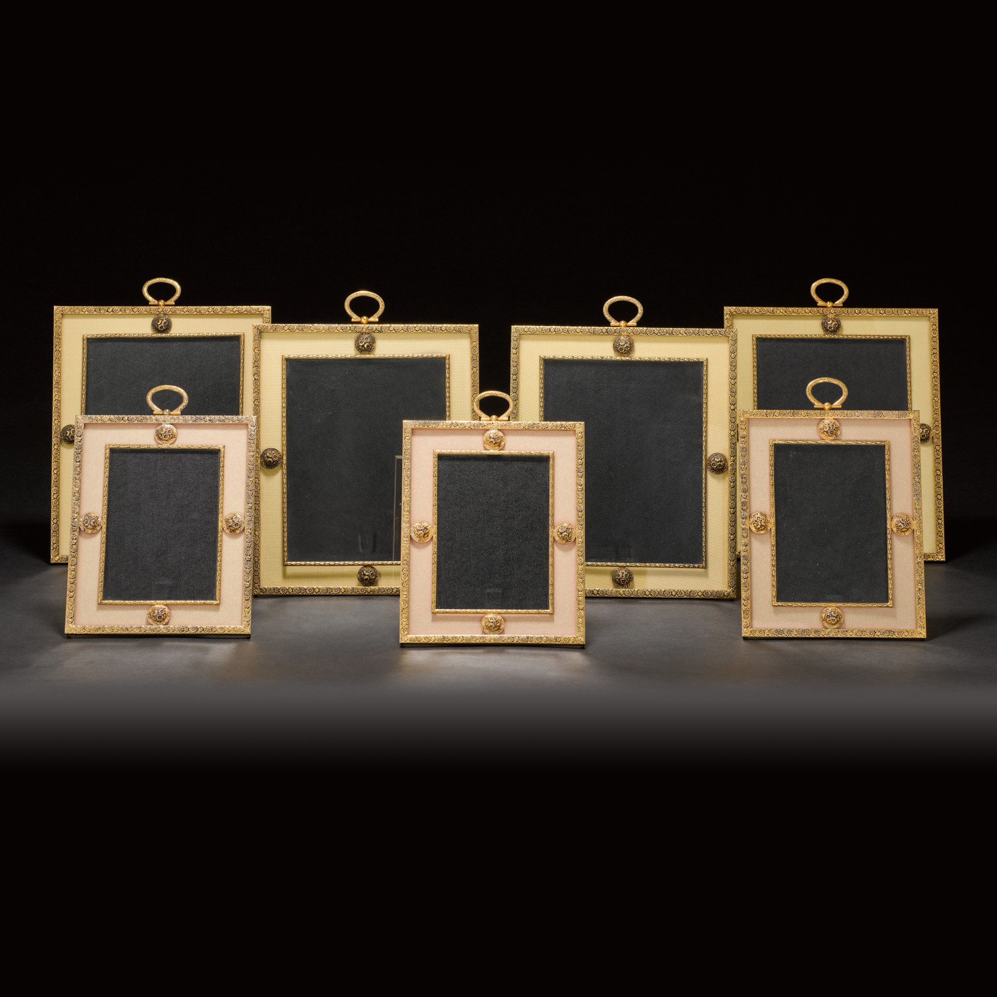A set of eighteen gilt-metal mounted rectangular photograph frames ...