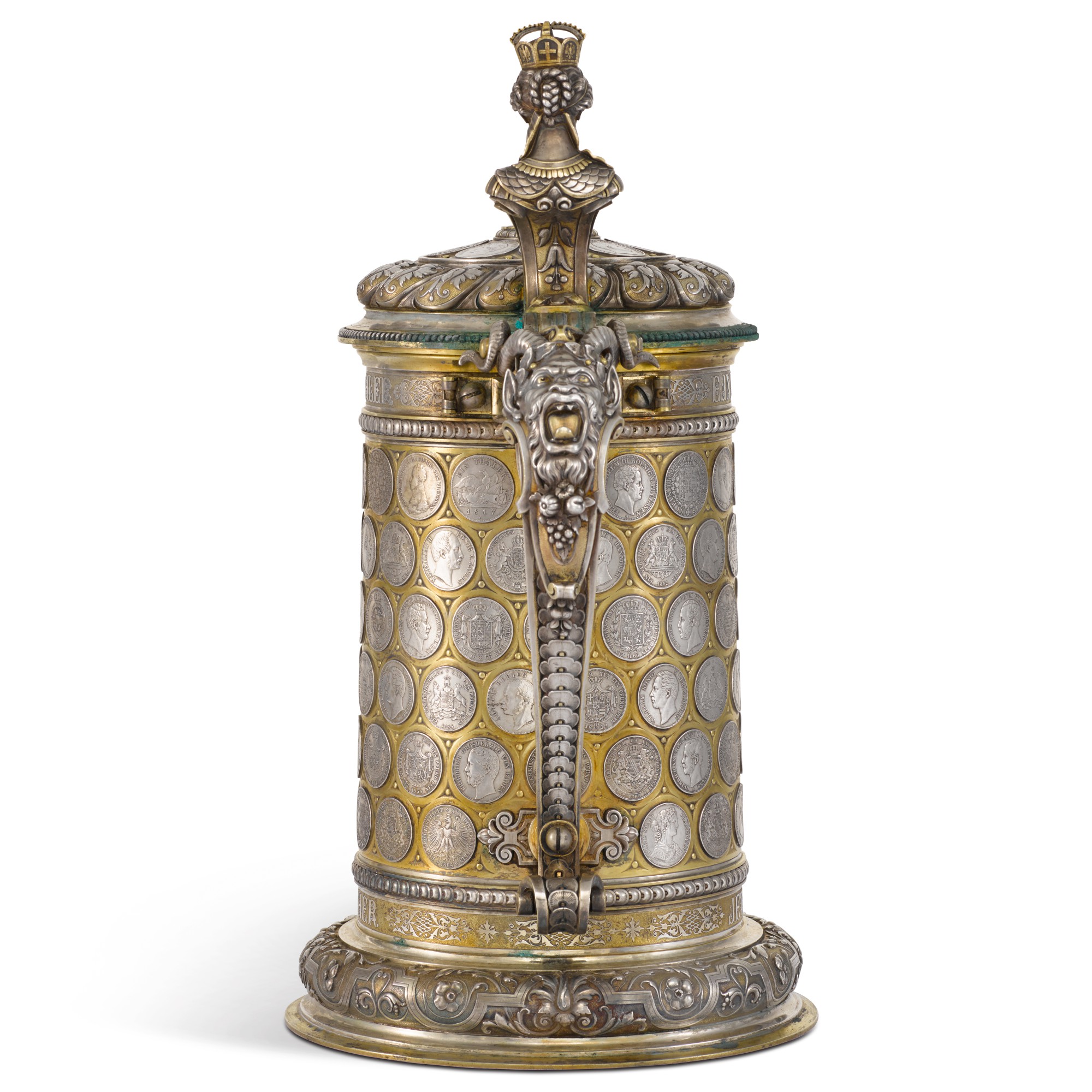 An unusually large German parcel-gilt silver coin-set tankard, possibly ...