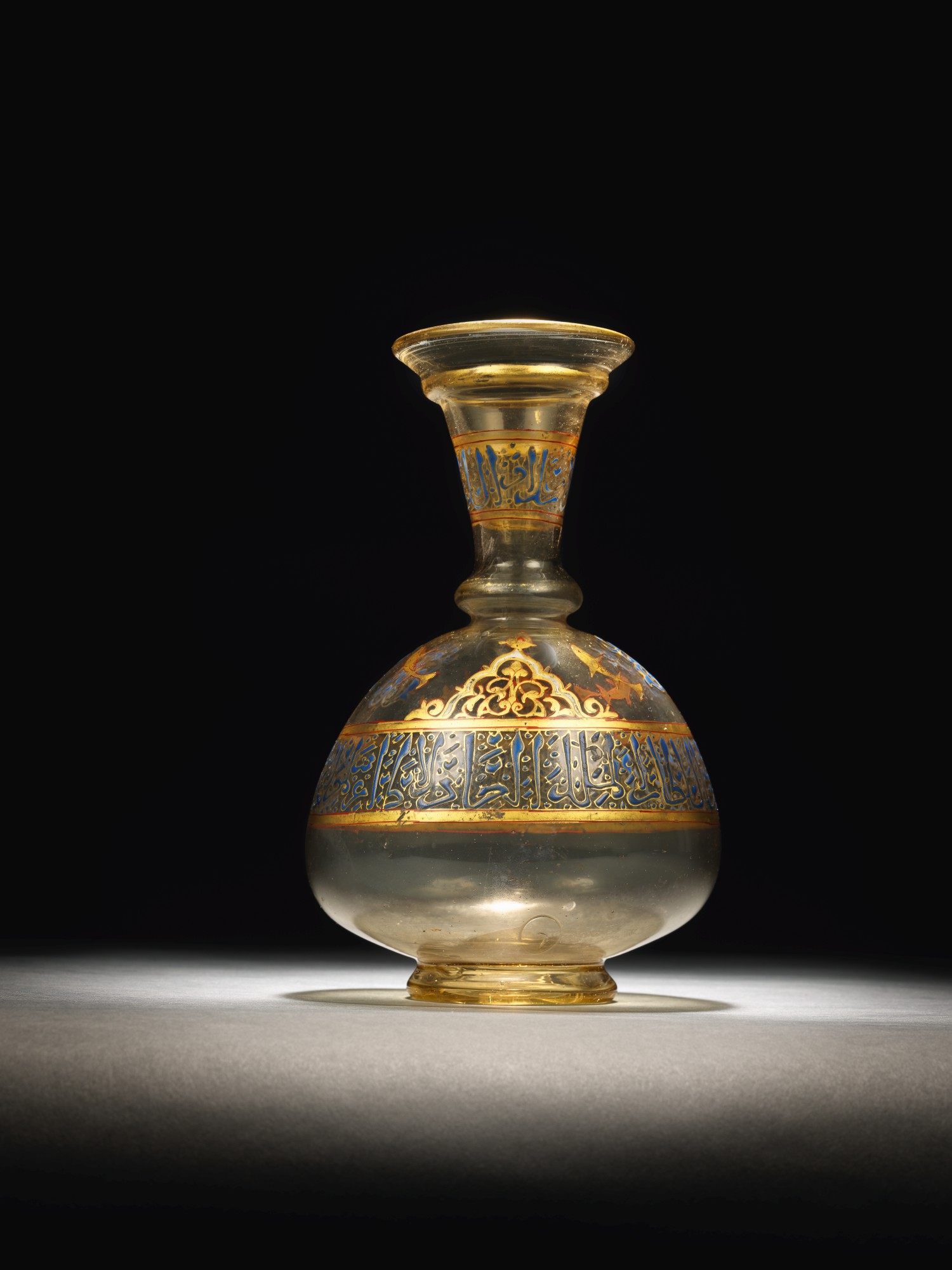 A HIGHLY IMPORTANT MAMLUK GILDED AND ENAMELLED GLASS FLASK, SYRIA, MID ...