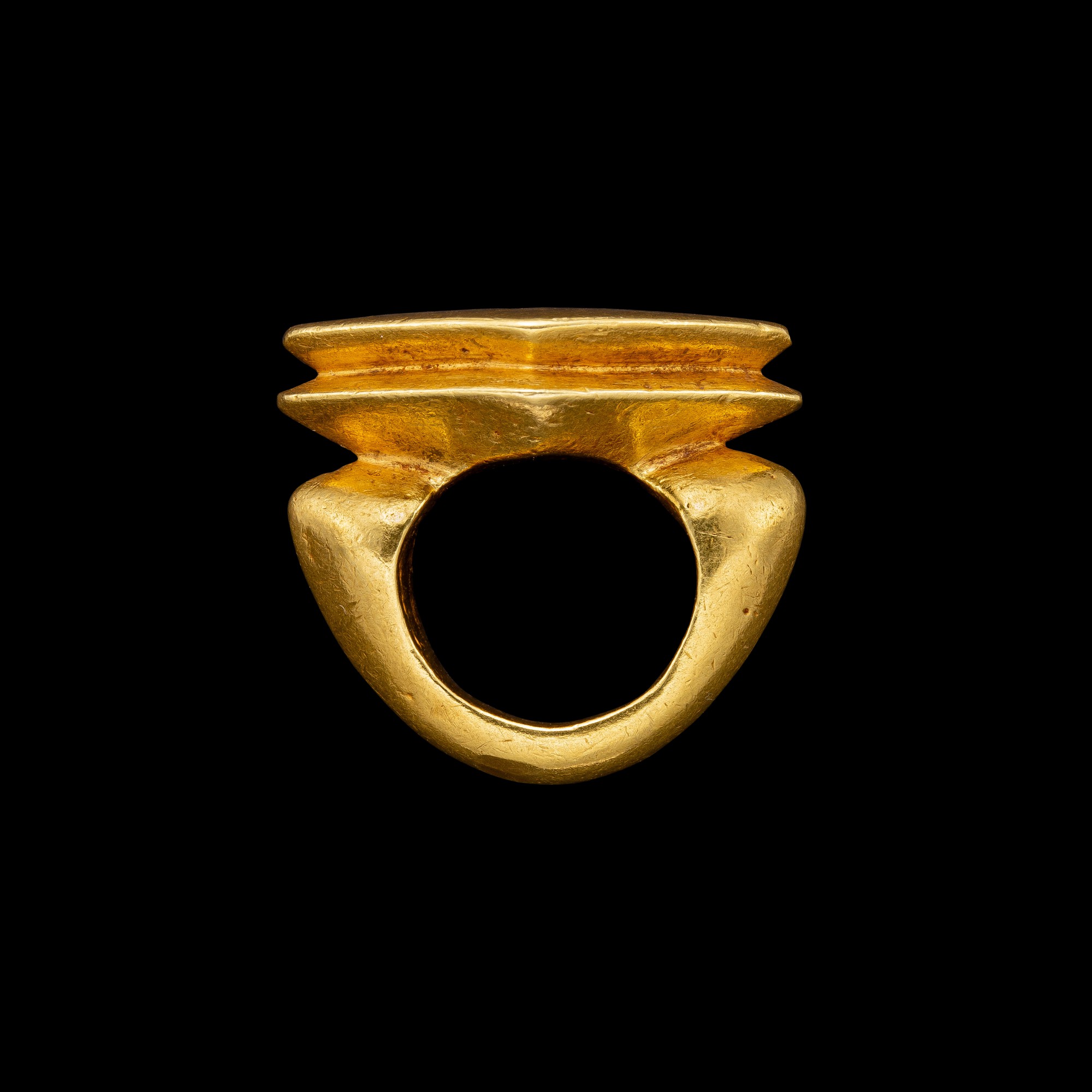 A gold ring with an inscribed lozenge bezel Central Java, Indonesia ...