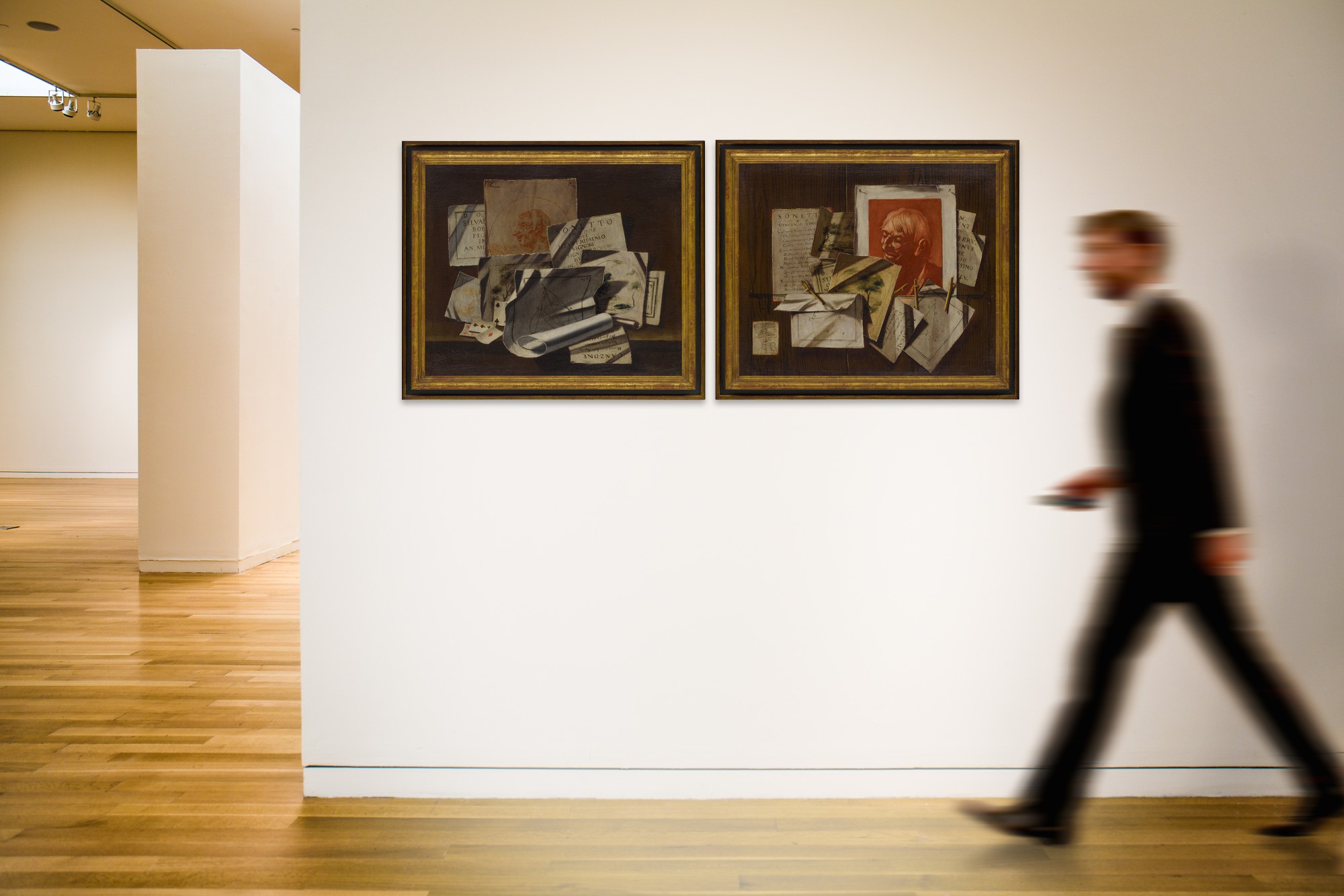 A pair of trompe-l'œil still lifes with portrait and landscape sketches ...