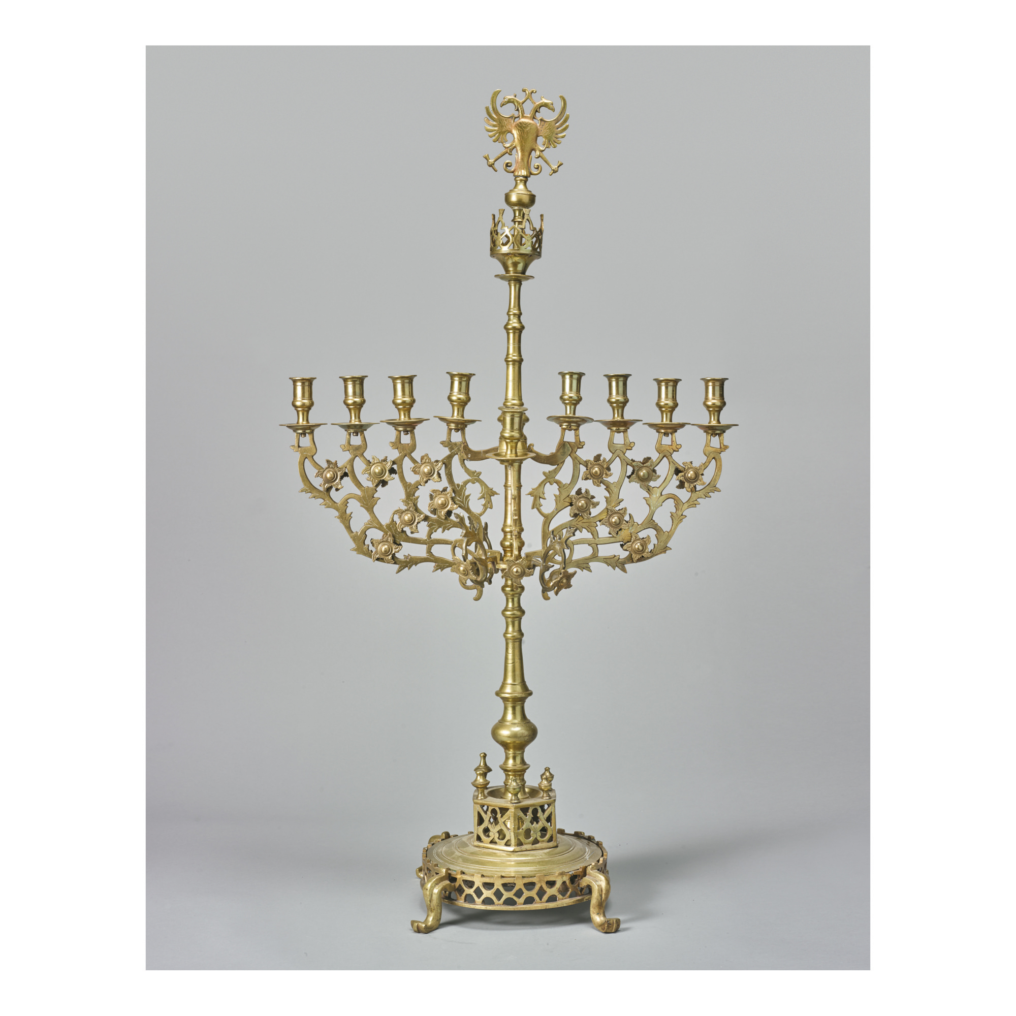 A MONUMENTAL BRASS STANDING HANUKAH MENORAH, POLISH OR GERMAN, 18TH ...