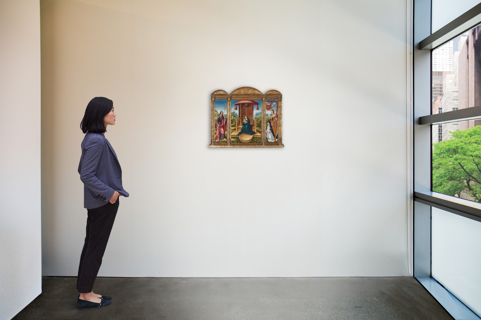 A triptych: The Virgin and Child enthroned in a landscape contiguous with the wings (central ...