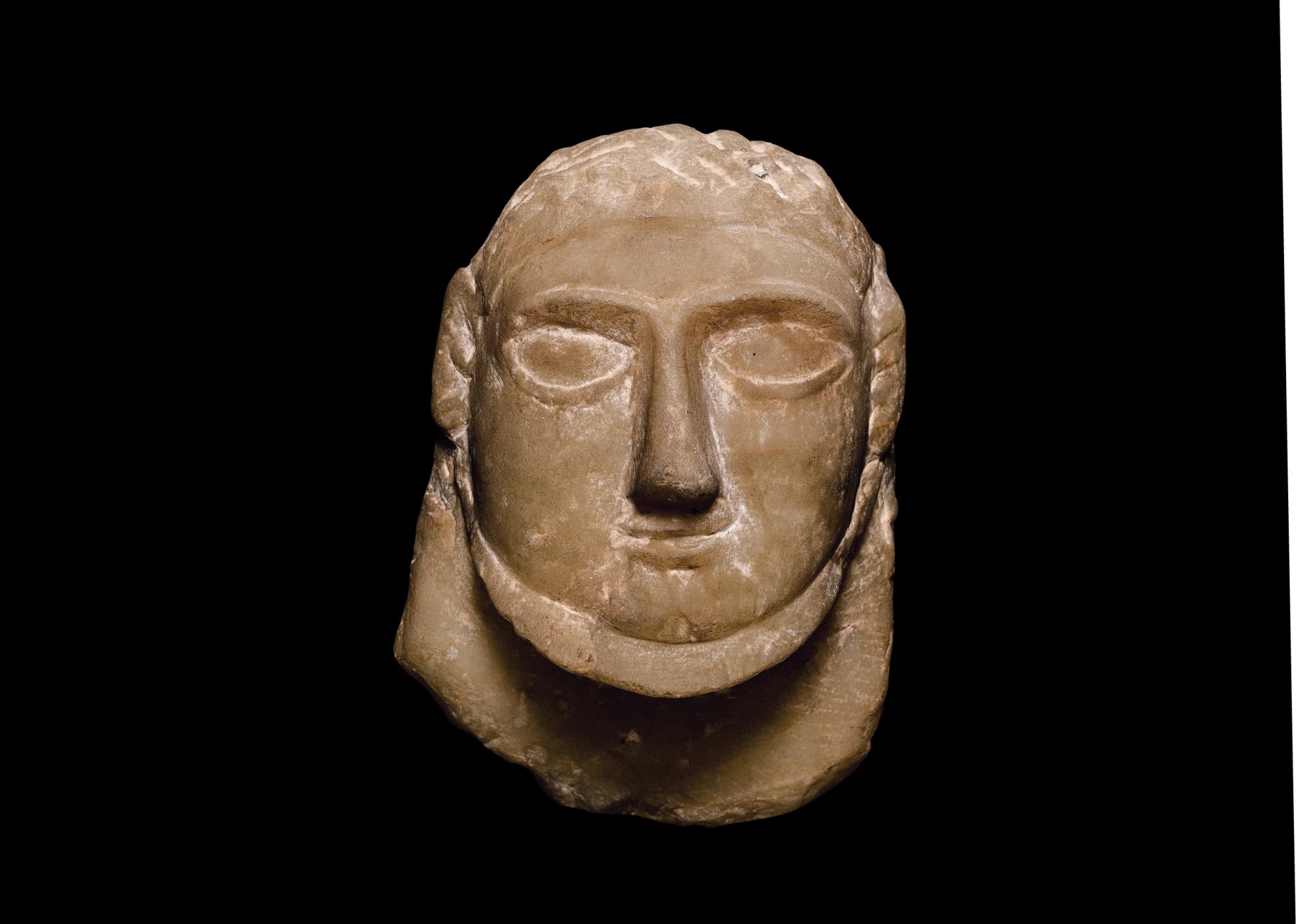 A SOUTH ARABIAN RELIEF HEAD OF A MAN, SABAEAN, 4TH/3RD CENTURY B. C ...