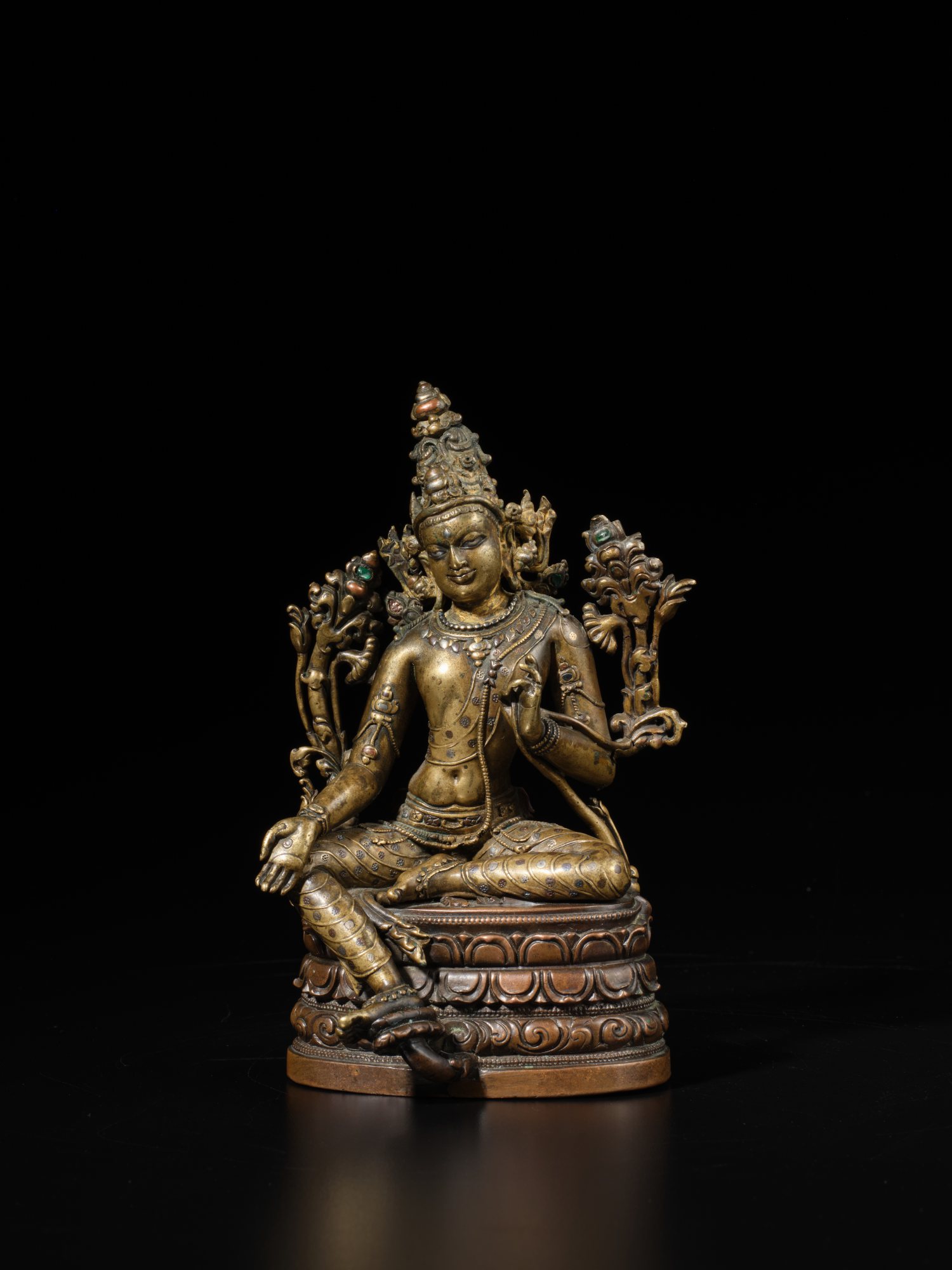 A large copper and silver-inlaid figure of Avalokiteshvara, Eastern ...