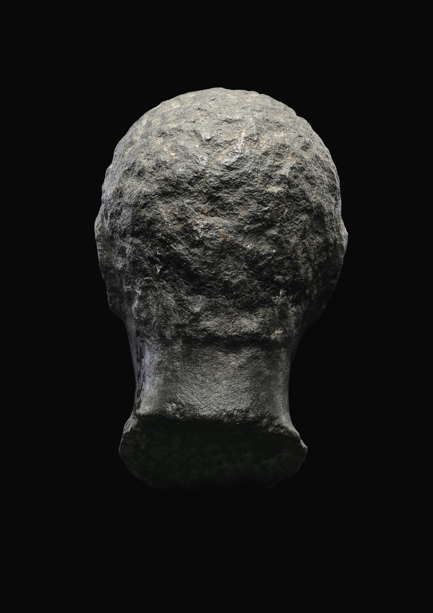 AN EGYPTIAN BASALT HEAD OF A MAN, LATE PTOLEMAIC PERIOD, CIRCA 100-30 B ...