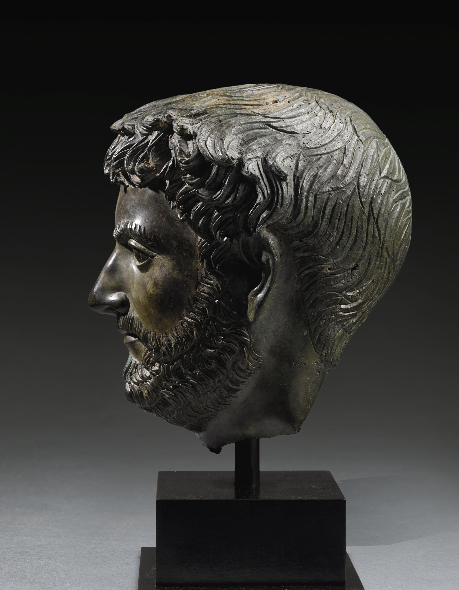 A ROMAN BRONZE PORTRAIT HEAD OF A MAN, HADRIANIC, CIRCA EARLY 2ND ...