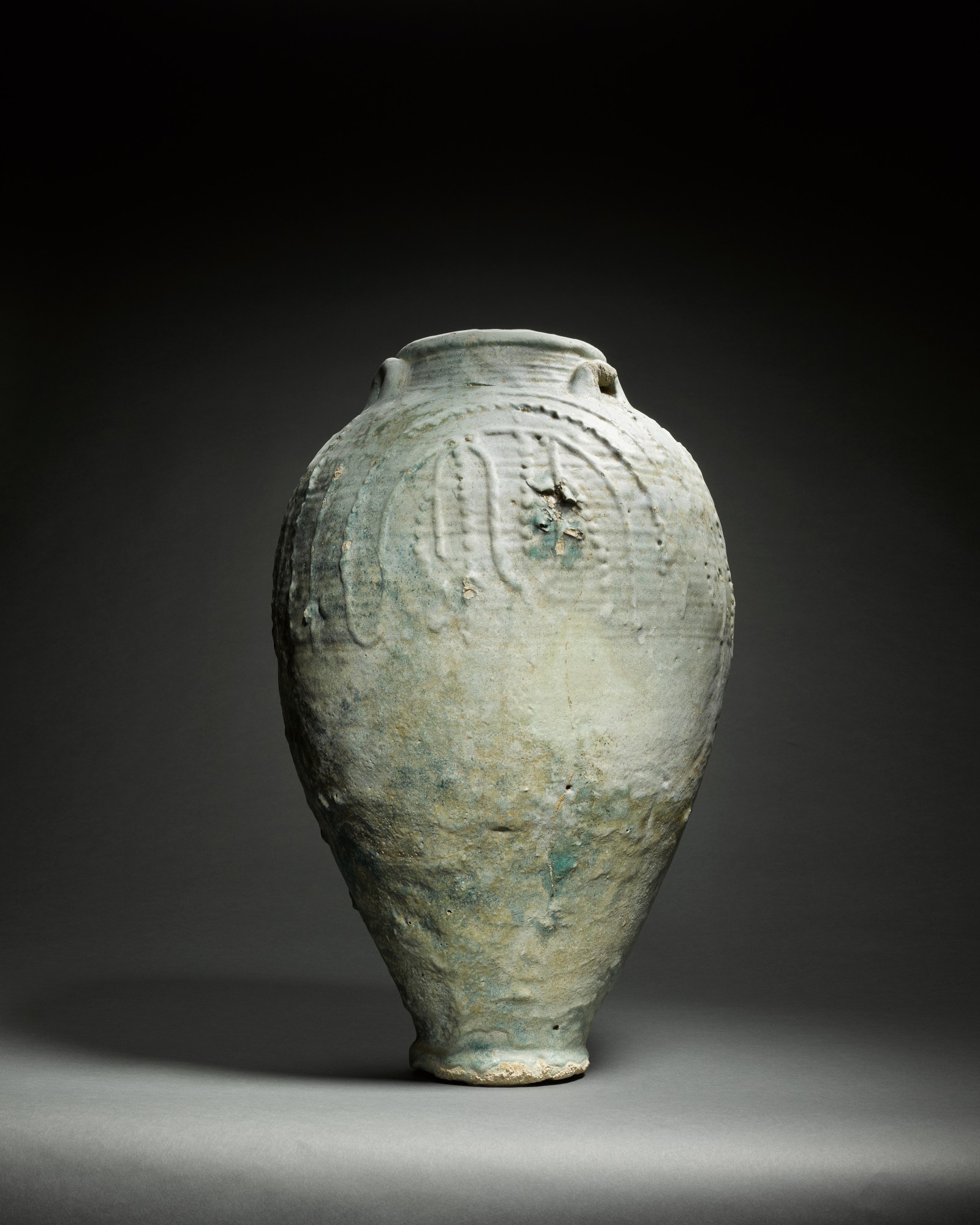 A large Umayyad turquoise-green glazed jar, Mesopotamia, 7th/8th ...
