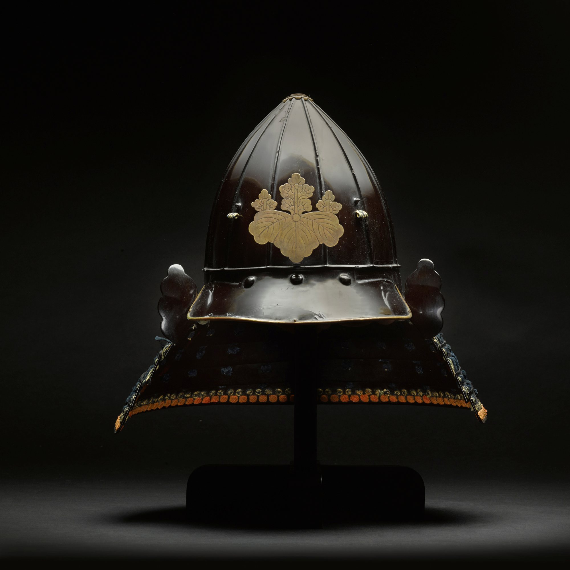 A rare toppai-nari kabuto [high-sided helmet] and mempo [face mask ...