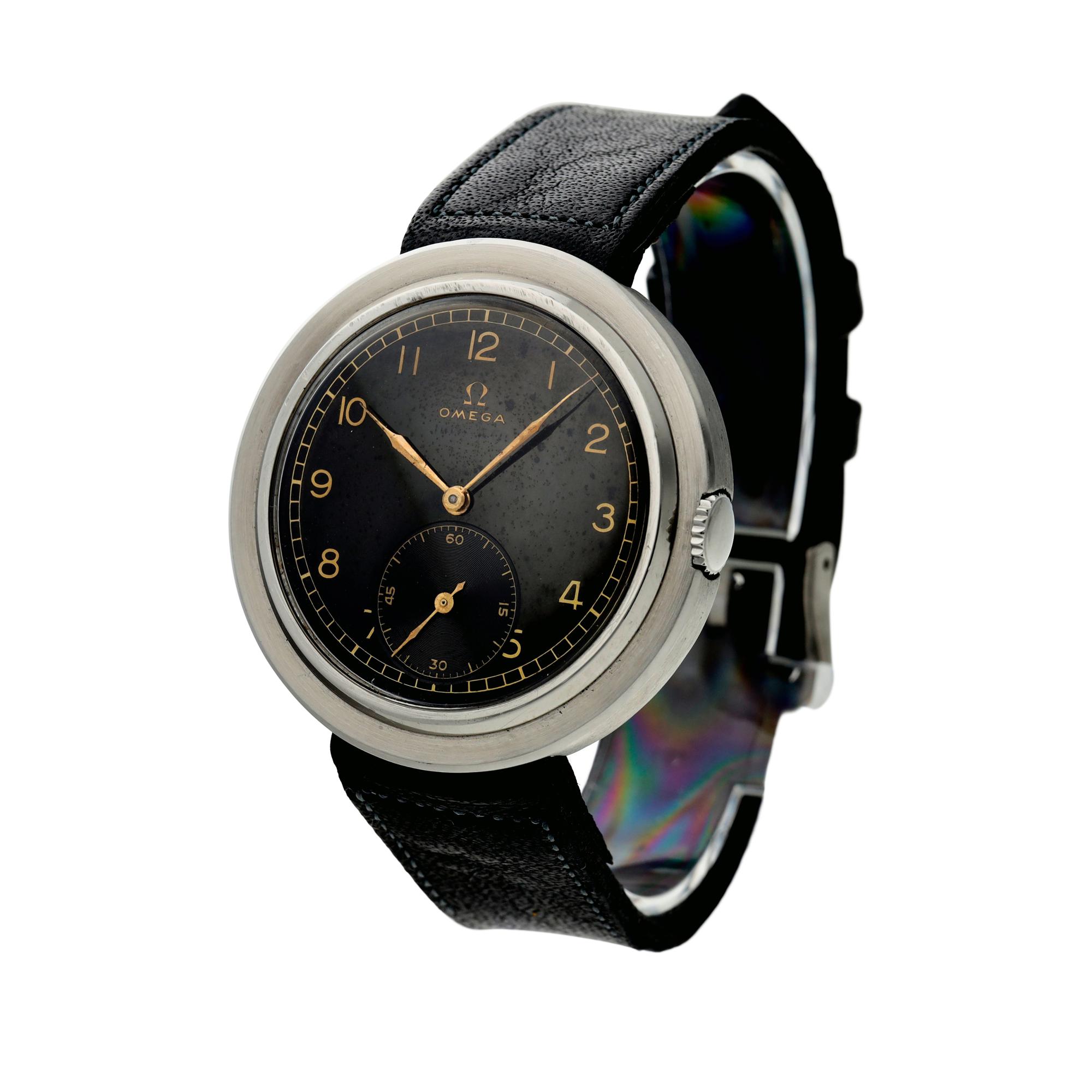 Disco Volante, An oversized stainless steel wristwatch with gilt dial ...