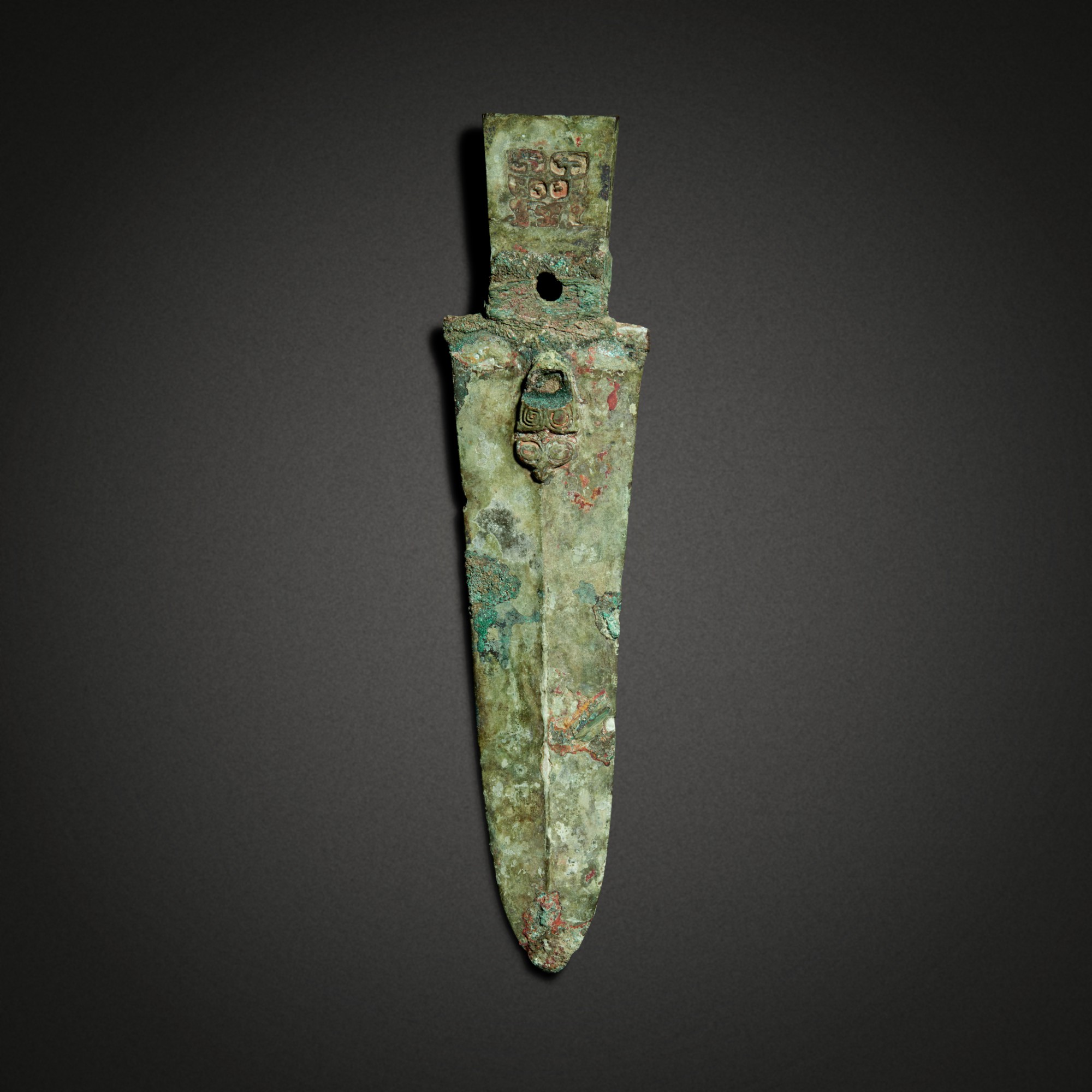 A rare archaic bronze 'taotie and cicada' dagger axe (Ge), Late Shang ...