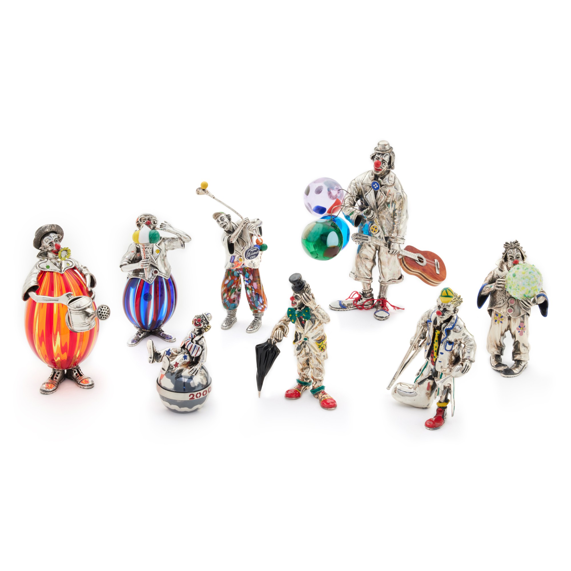 A group of eight Italian silver, enamel, and Murano glass clowns ...