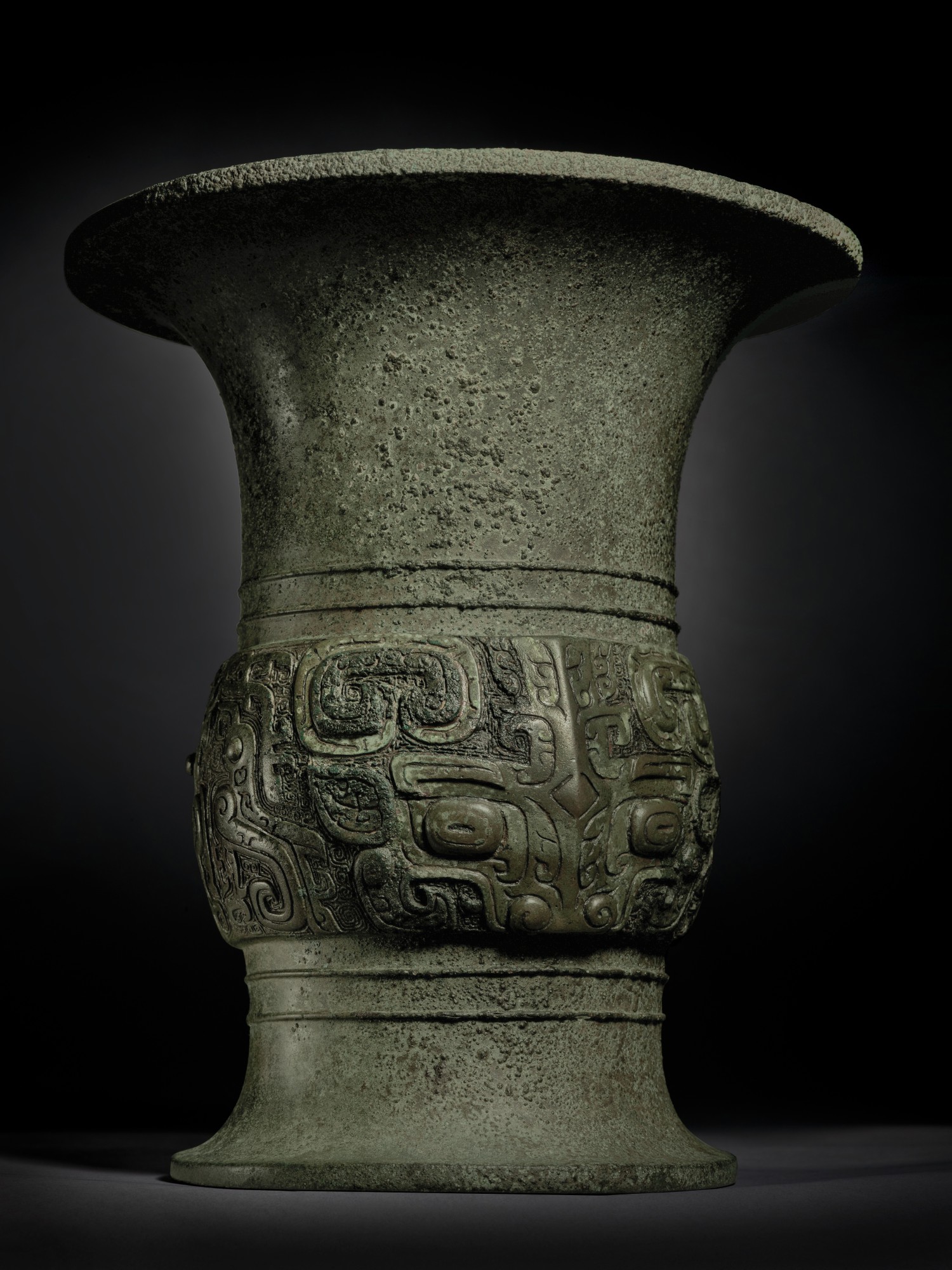 A rare and impressive inscribed archaic bronze ritual wine vessel (Zun ...