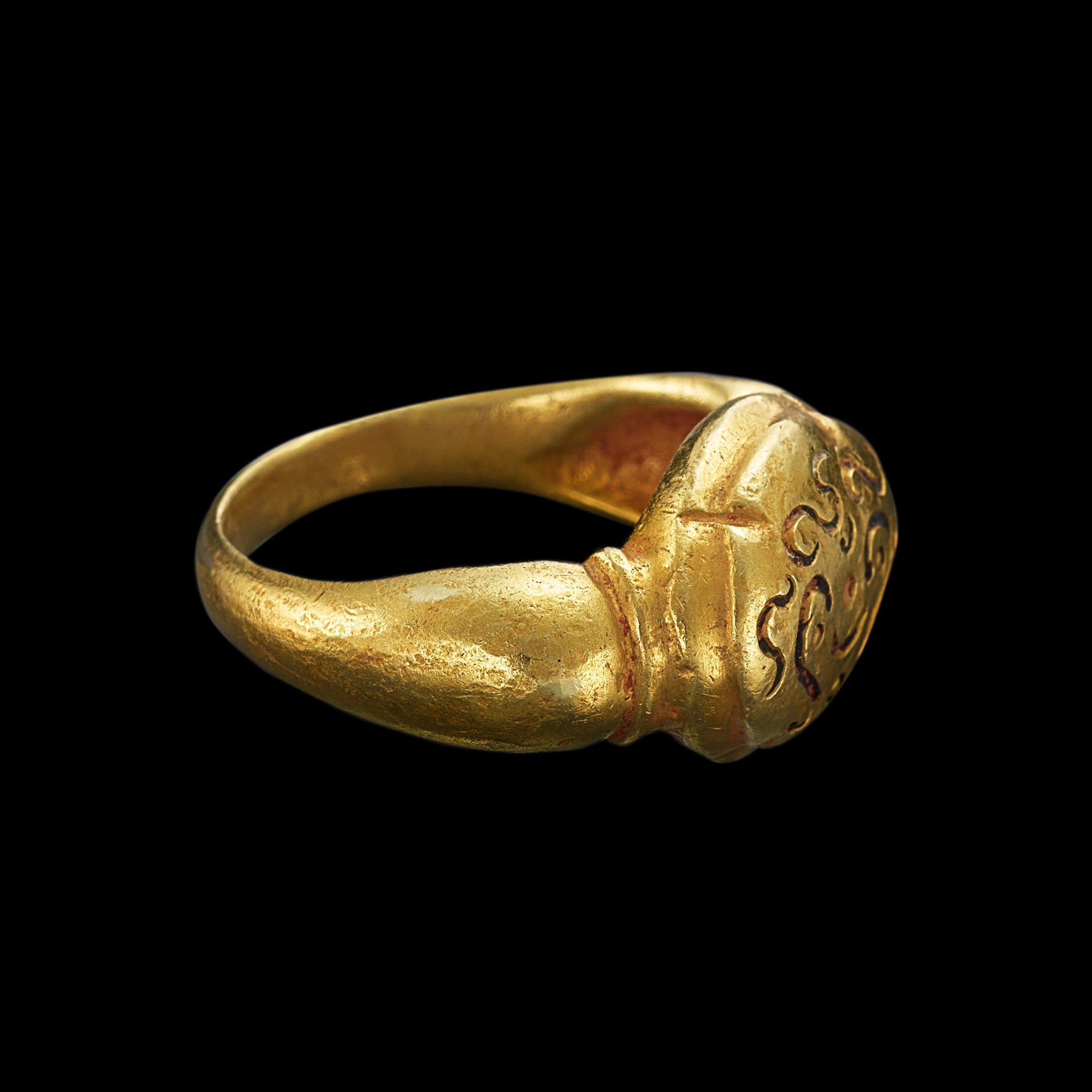A solid gold ring with an incised bezel Java, Indonesia, 7th-12th ...