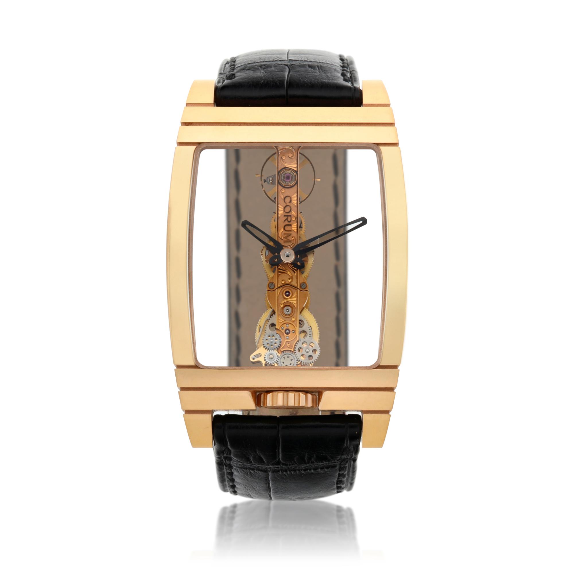Golden Bridge A pink gold tonneau shaped skeletonized wristwatch, Circa ...