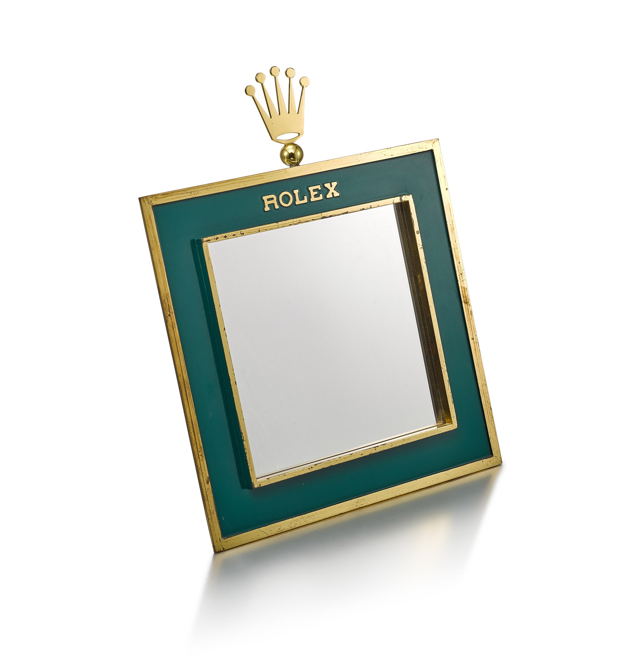 ROLEX | A GILT BRASS AND GREEN ENAMEL RETAILER'S DISPLAY MIRROR WITH ...