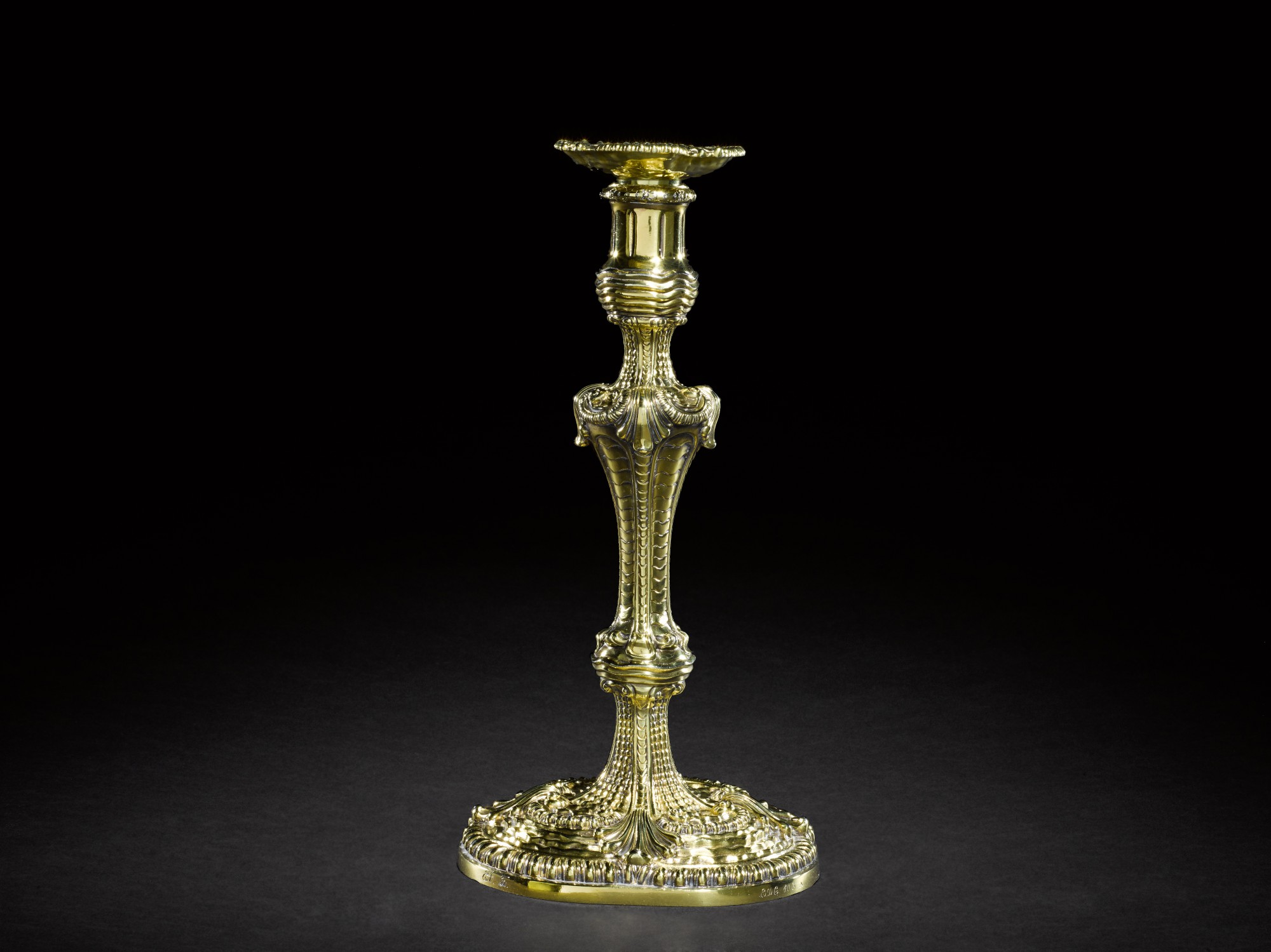 Royal: A set of twelve silver-gilt candlesticks, two William Solomon ...