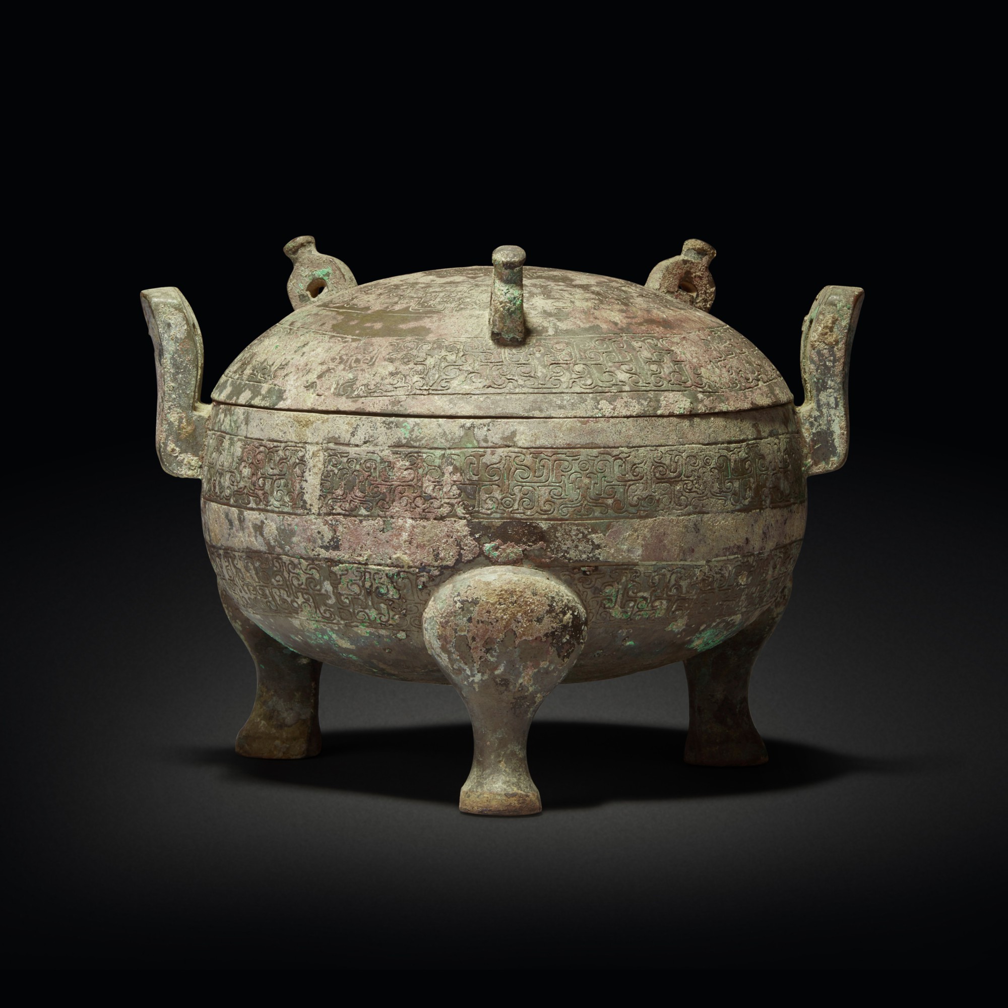 An archaic bronze ritual food vessel and cover (Ding), Eastern Zhou ...