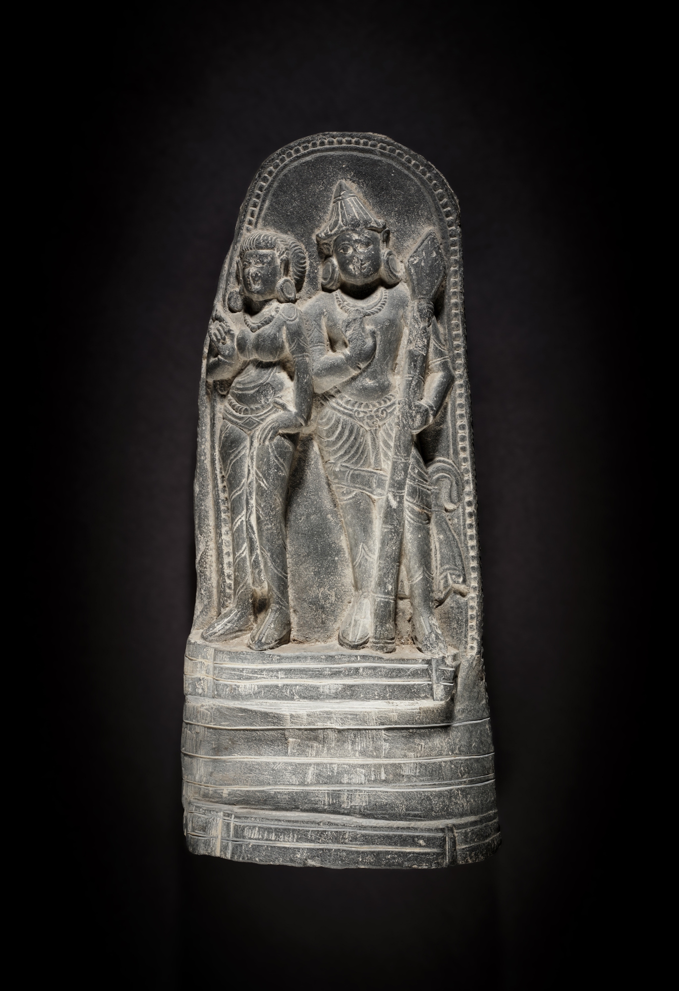 A black stone stele depicting royalty, East India, Pala period, 11th ...